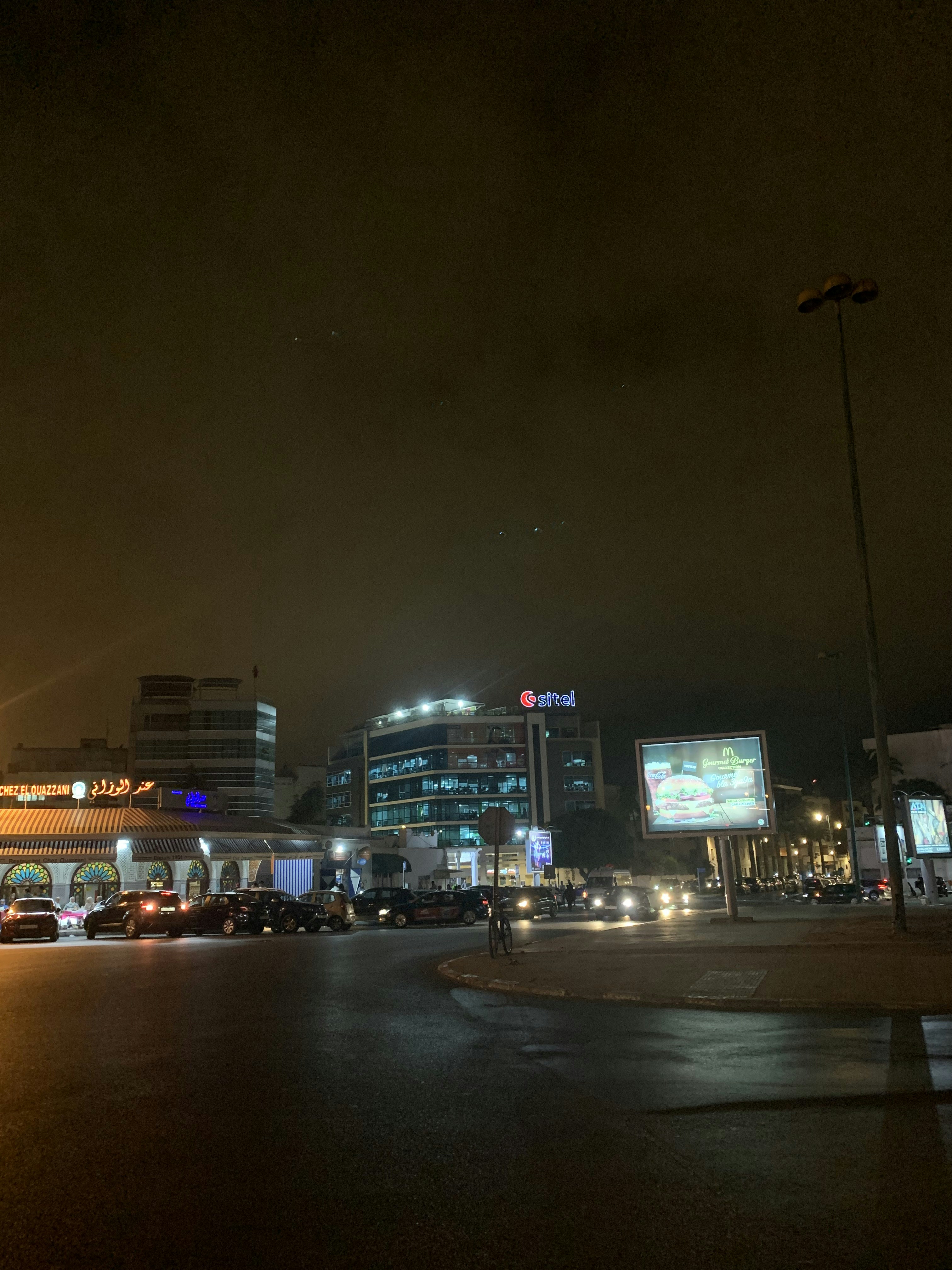 Night at the City Center: Neon Promises and Moving Traffic