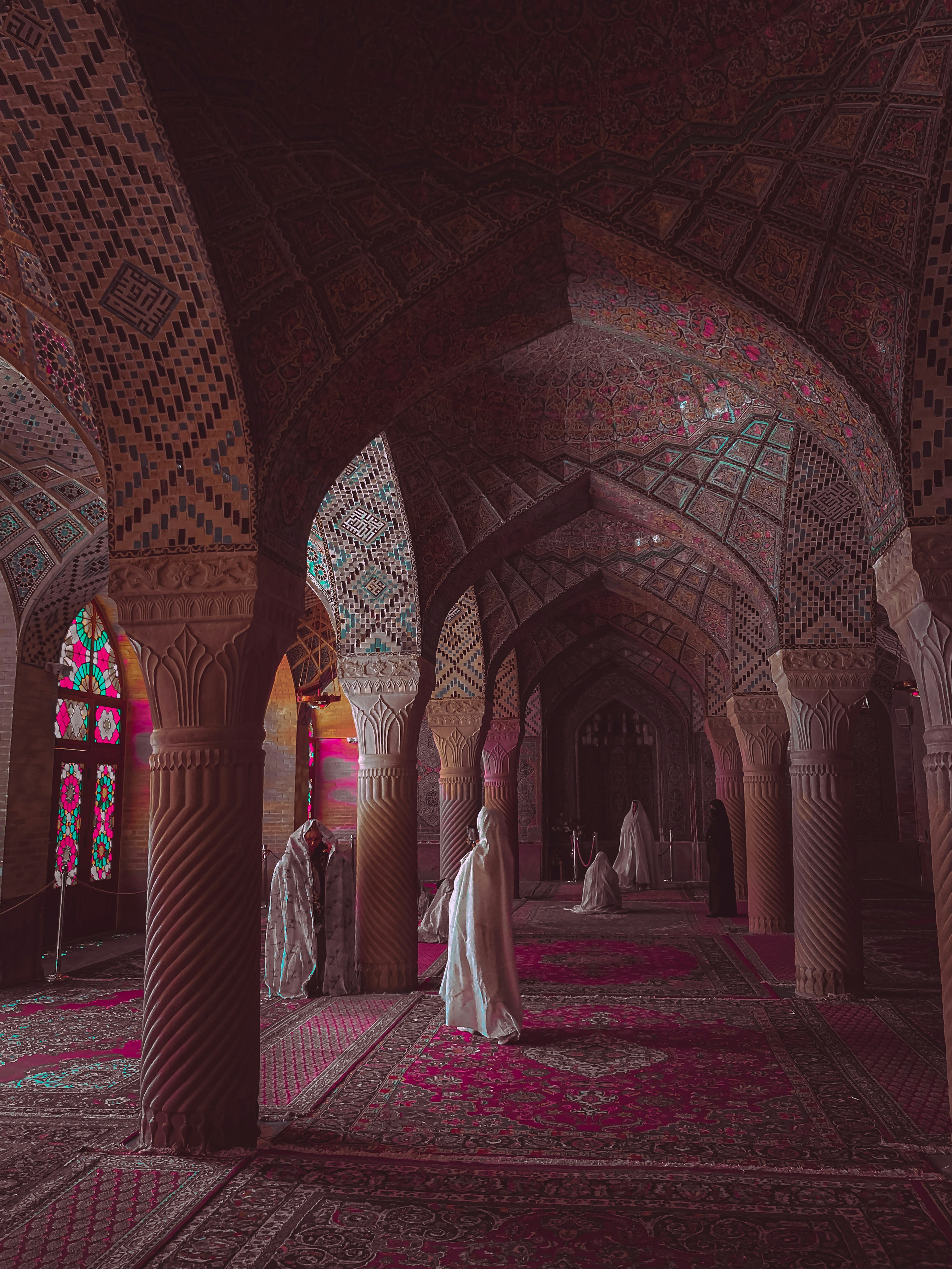 Crimson Light Through Carved Arches: A Quiet Prayer Hall