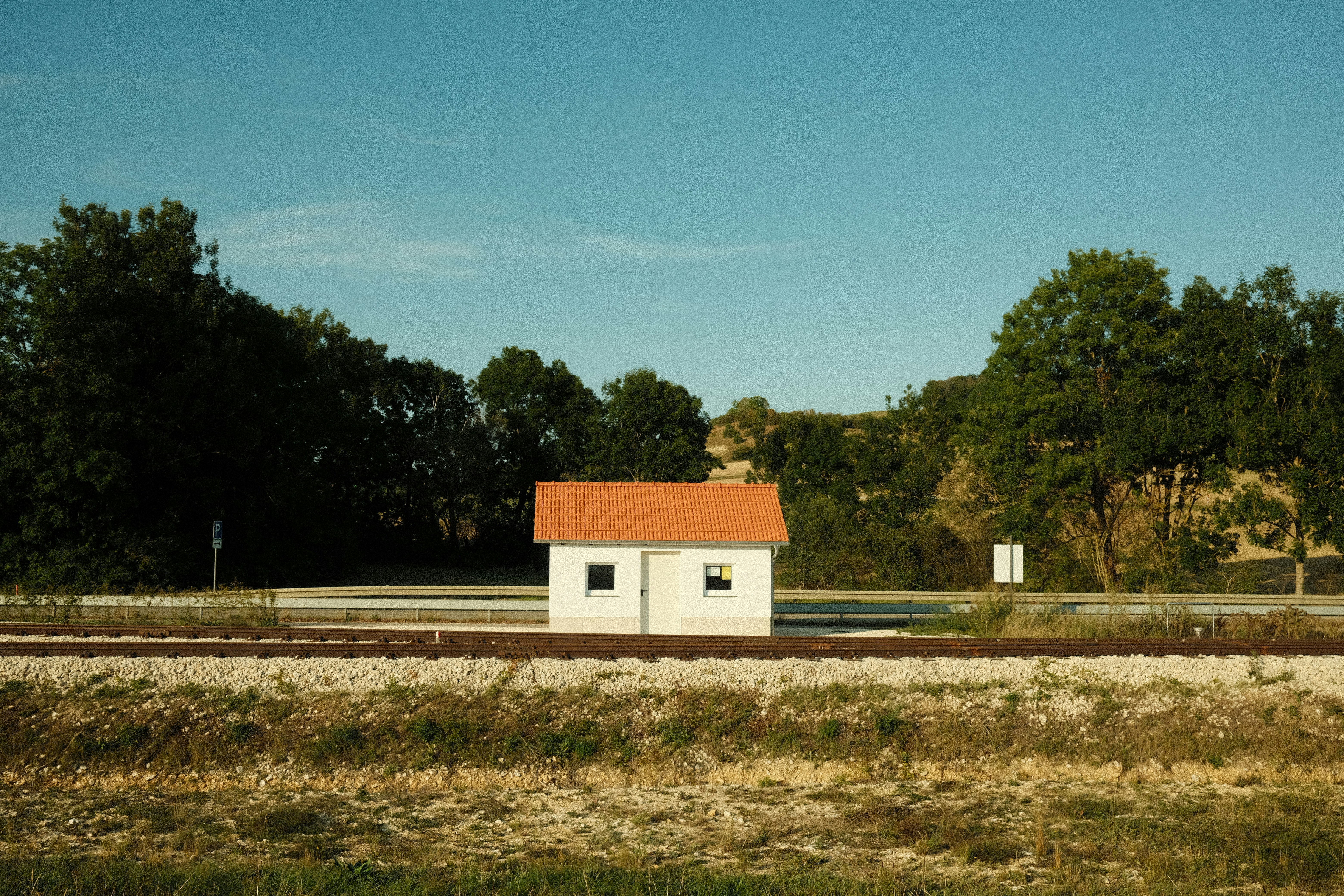 A small building next to train tracks photo – Free Germany Image on ...