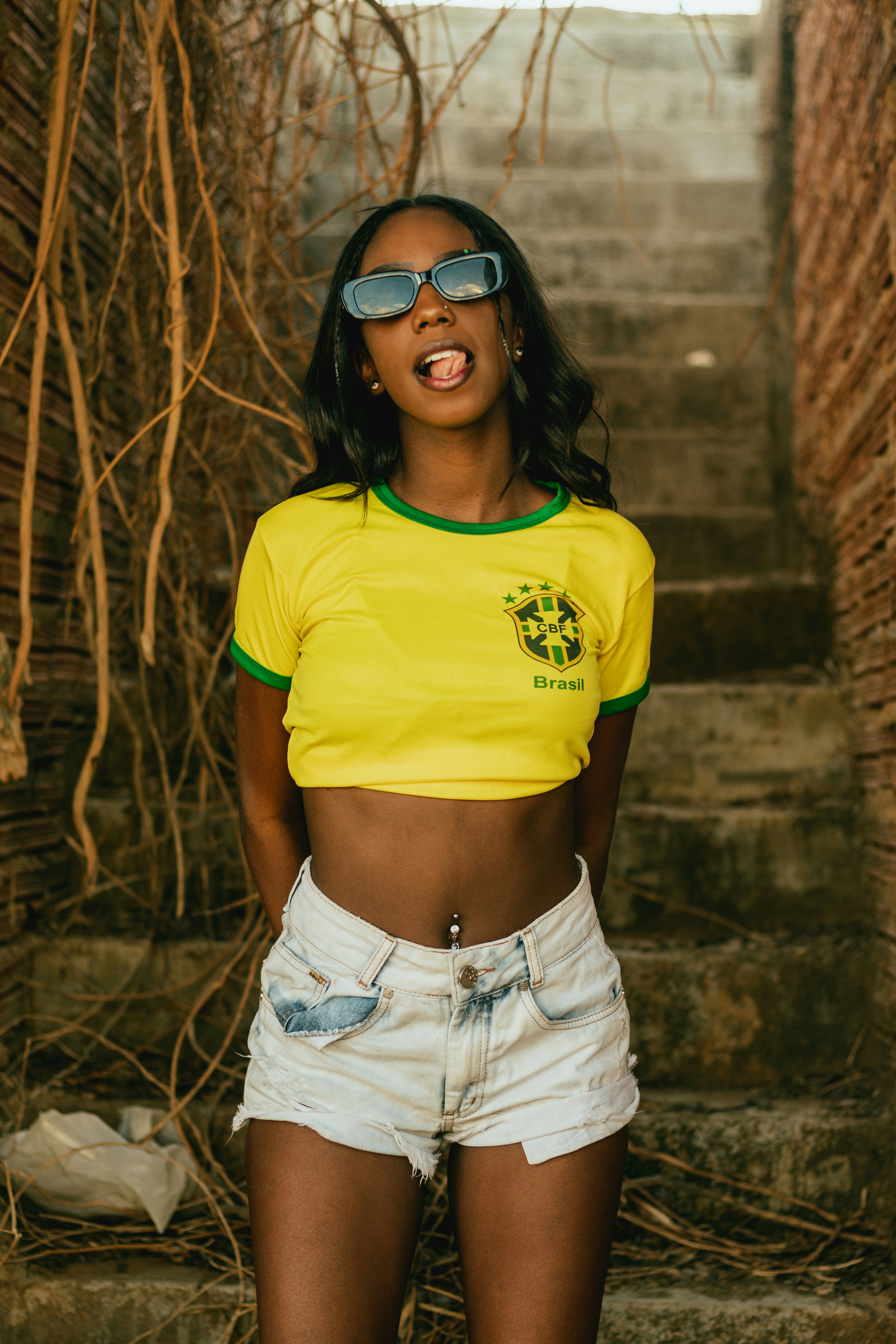 Sunlit Yellow Jersey, Bold Presence on Vine-Wrapped Steps