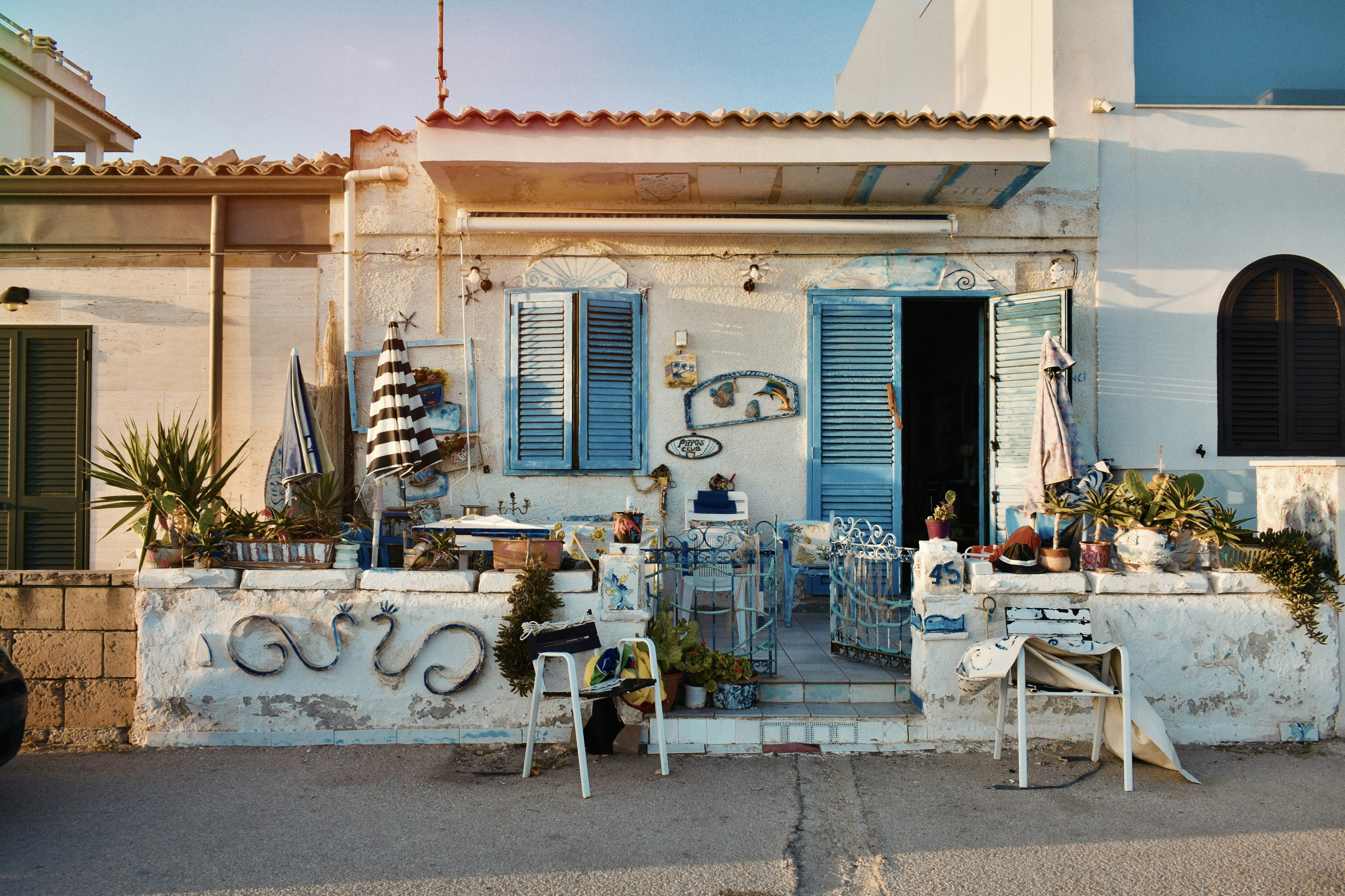 Sunlit Greek Café Awash in Sea-Tossed Blues