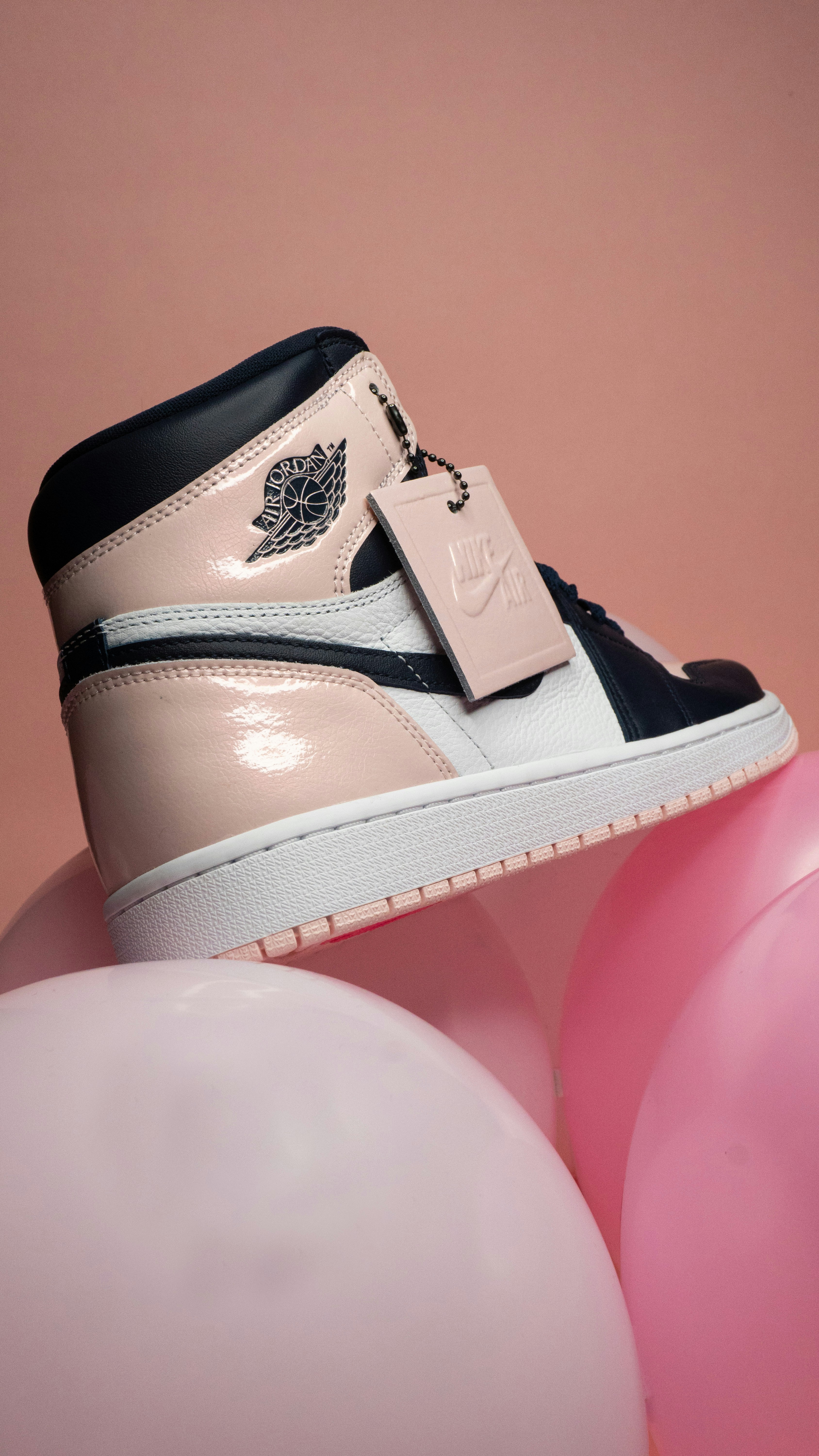 Pastel-Soled Air: A Neon-Soft Sneaker Surrounded by Balloons