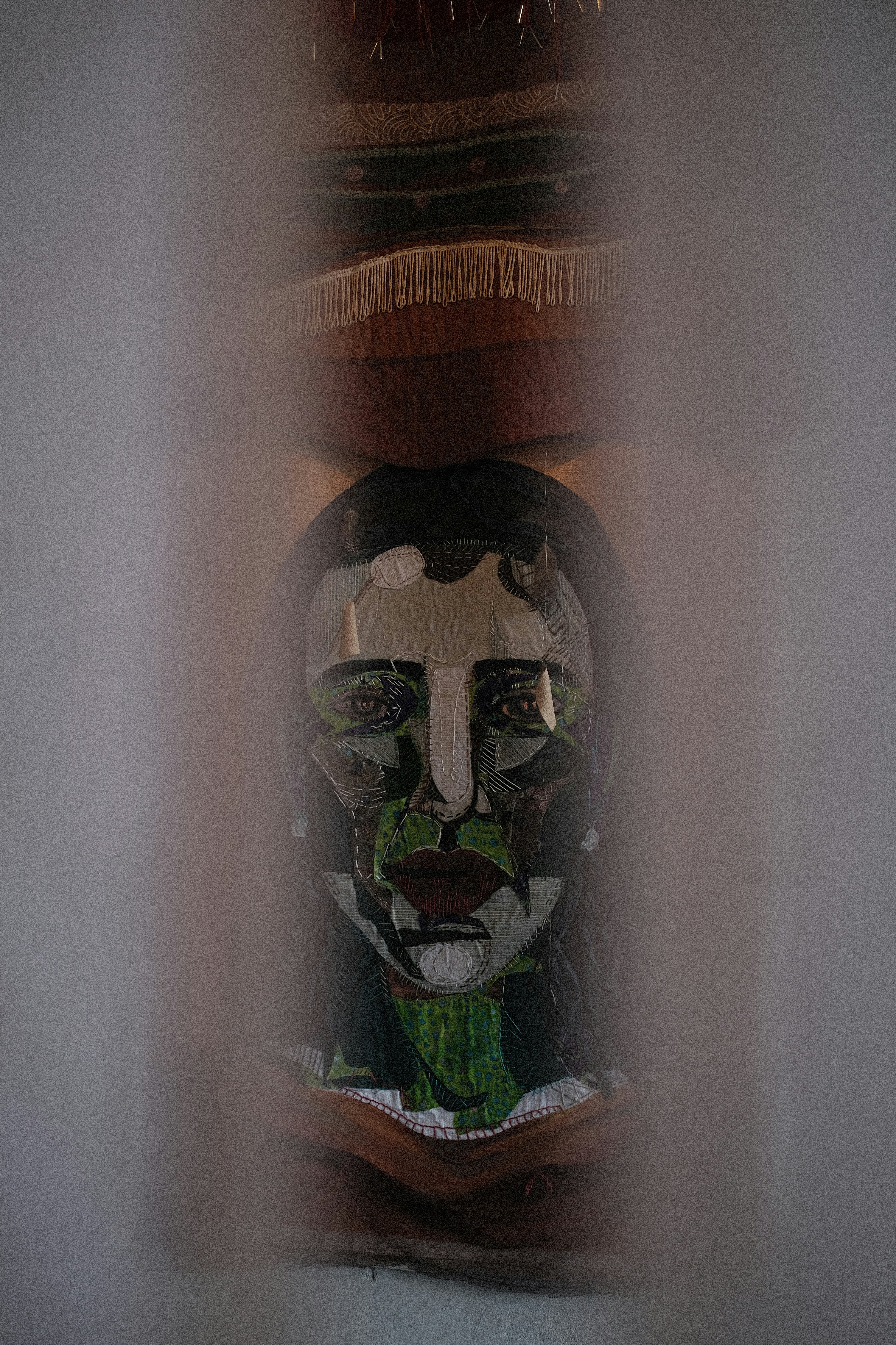 a glass lantern with a face