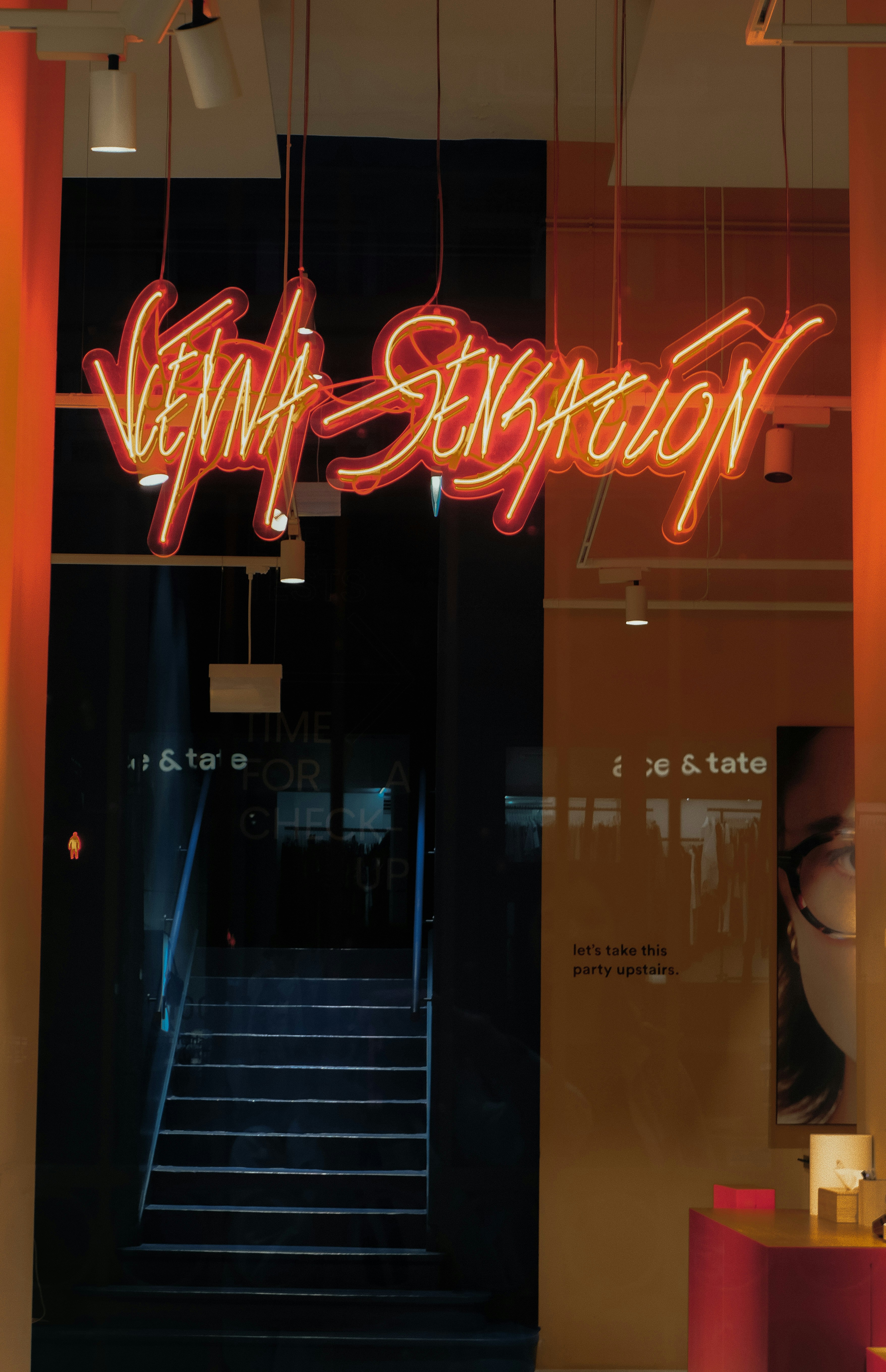 Neon Couture over a Stairwell in a Fashion Store
