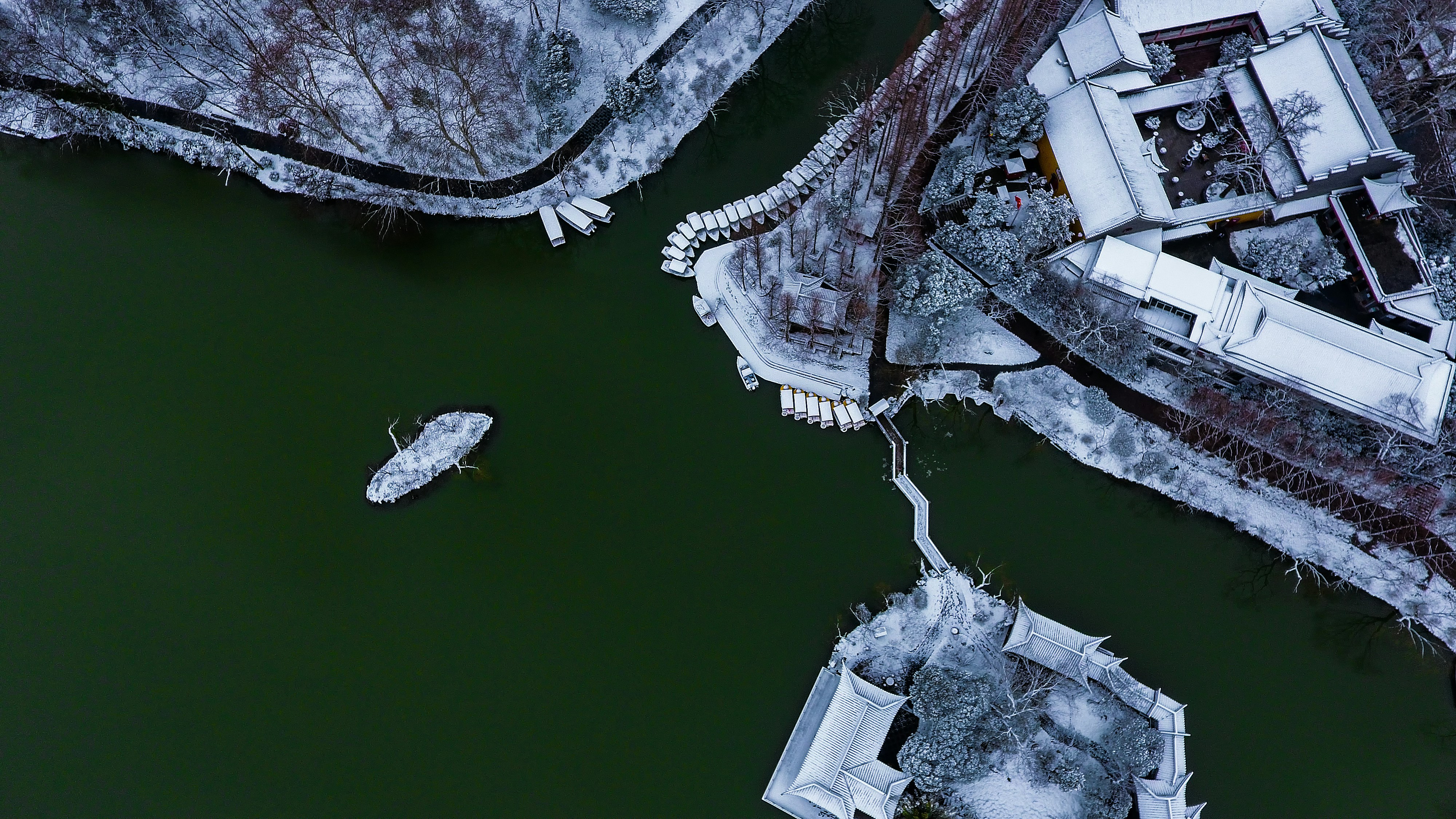 Snowbound Fortress Over Lake: Aerial View of Winter Architecture