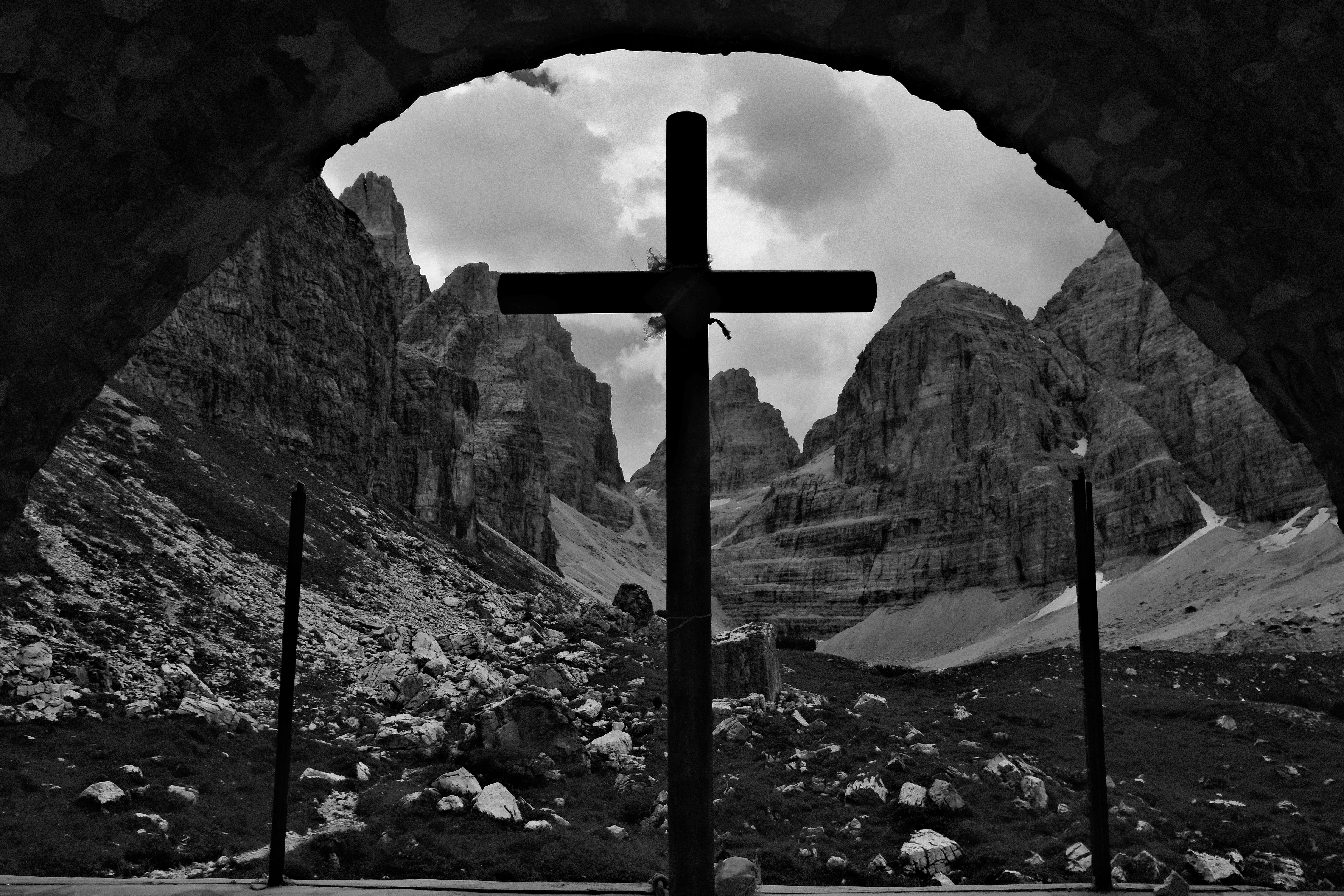 Lone Cross Beneath a Granite Gate: Alpine Shadows