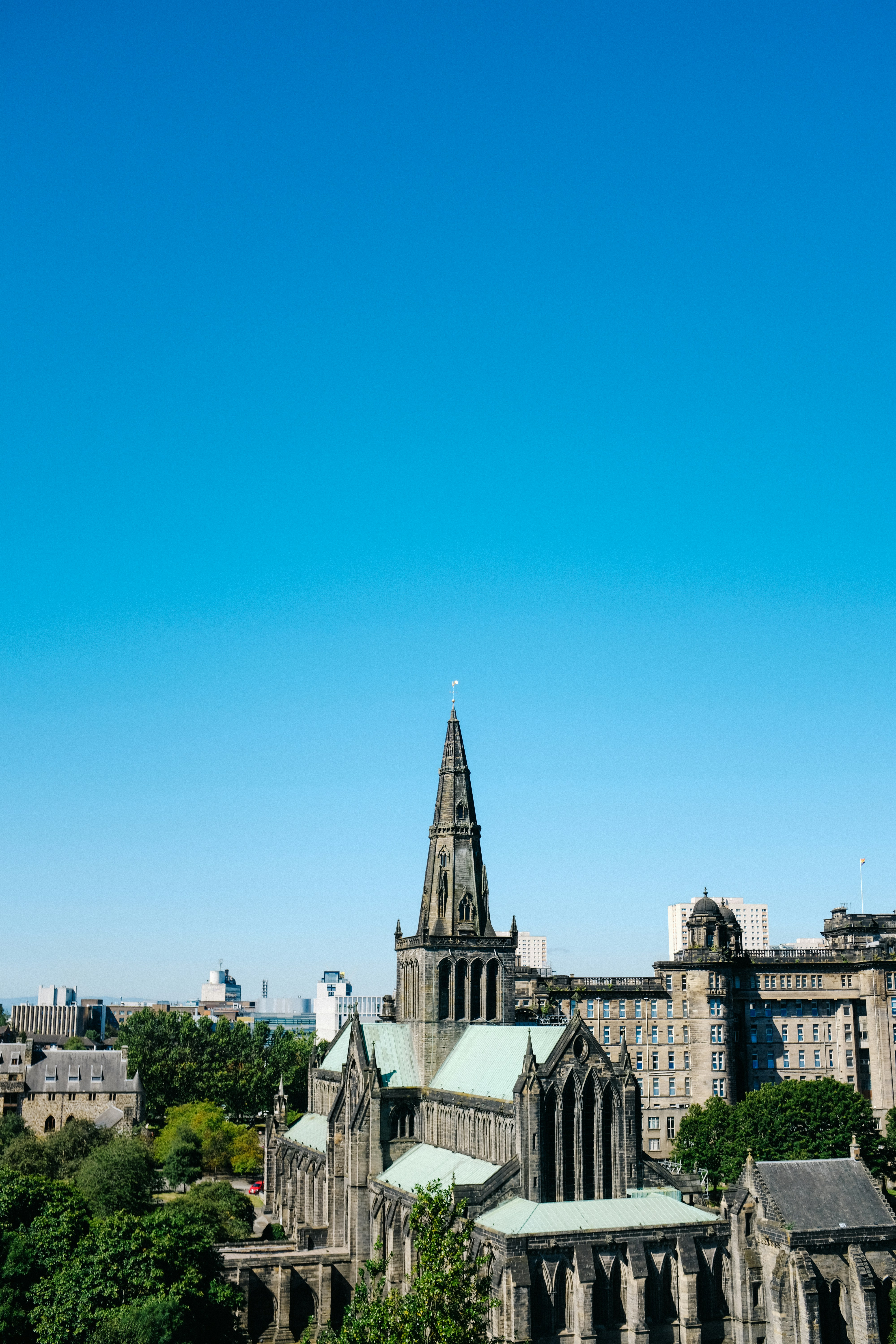 Cerulean Sky Over a Gothic Spire: A Cathedral's Quiet Dominance