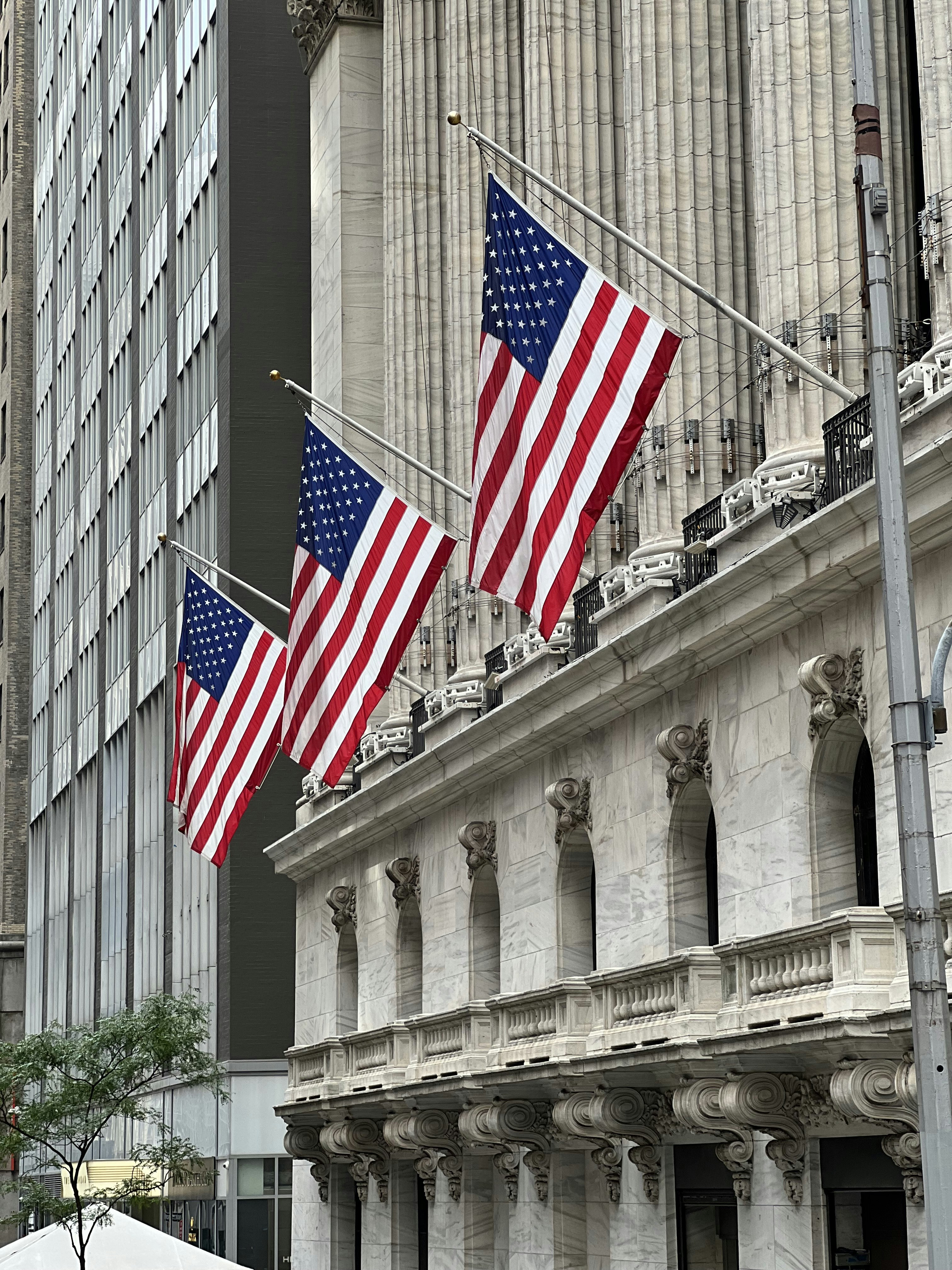 A couple of flags on a building photo – Free Flag Image on Unsplash