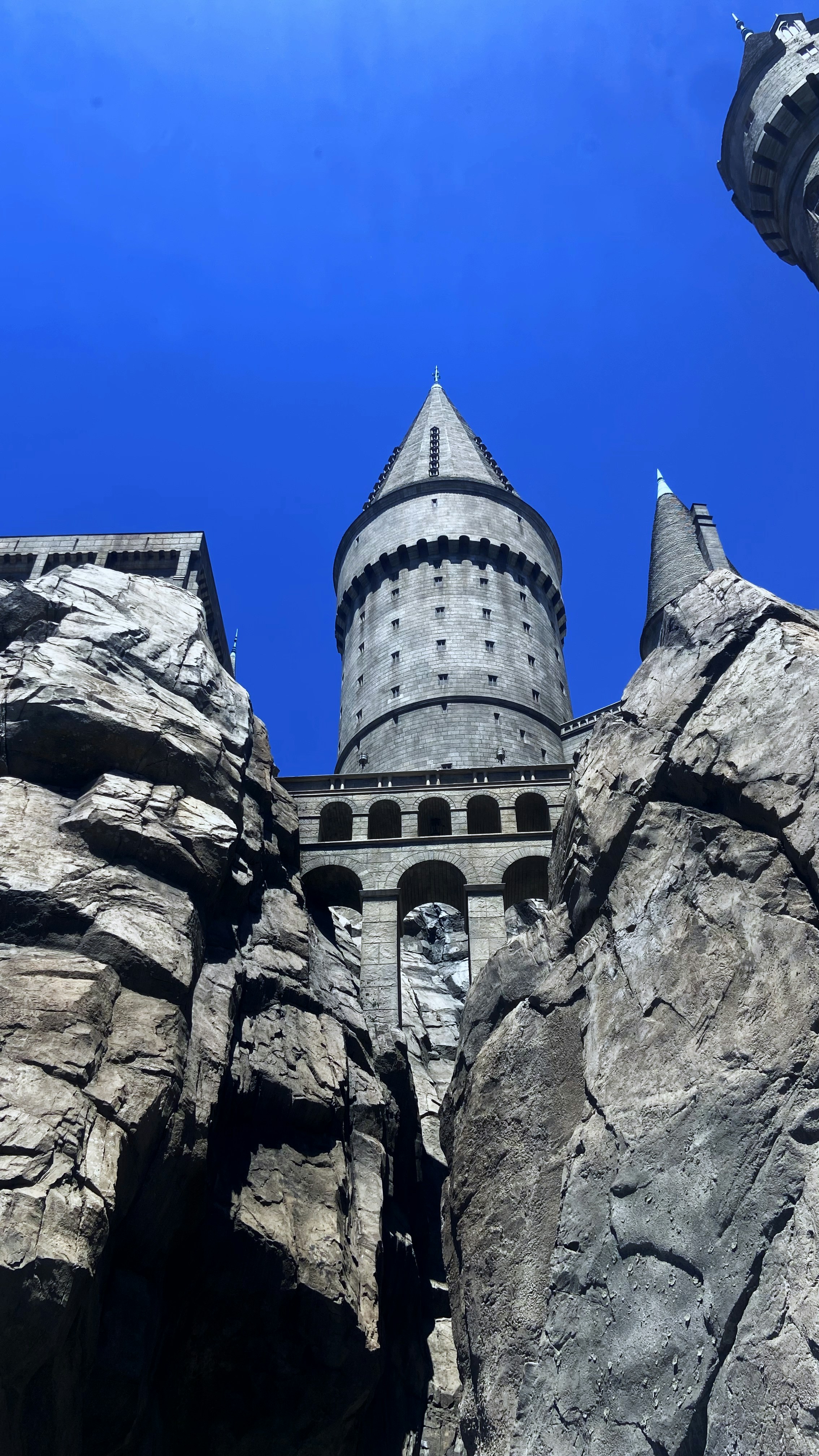 A stone building on a cliff photo – Free Blue Image on Unsplash