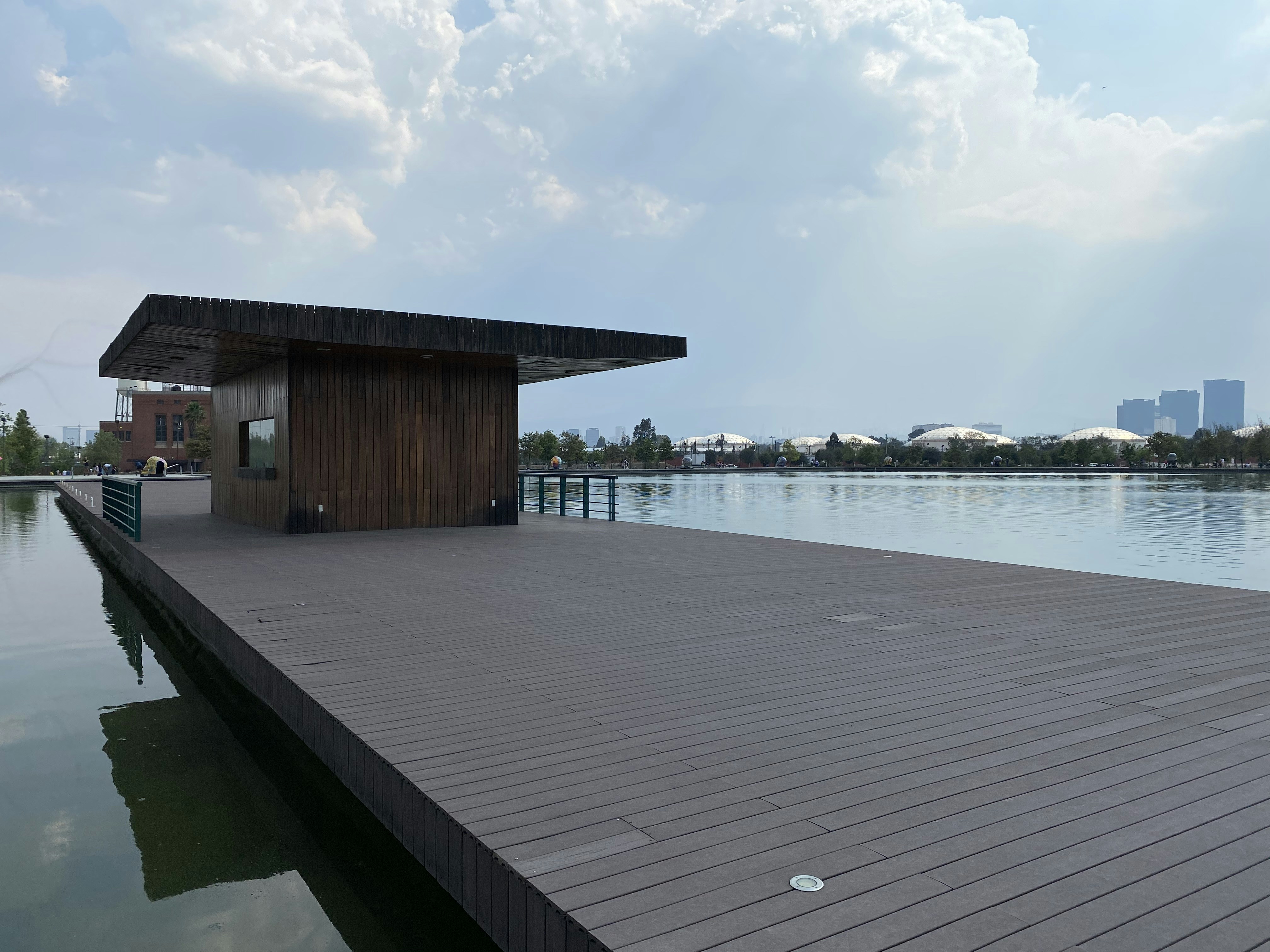 a wooden dock leading to a building