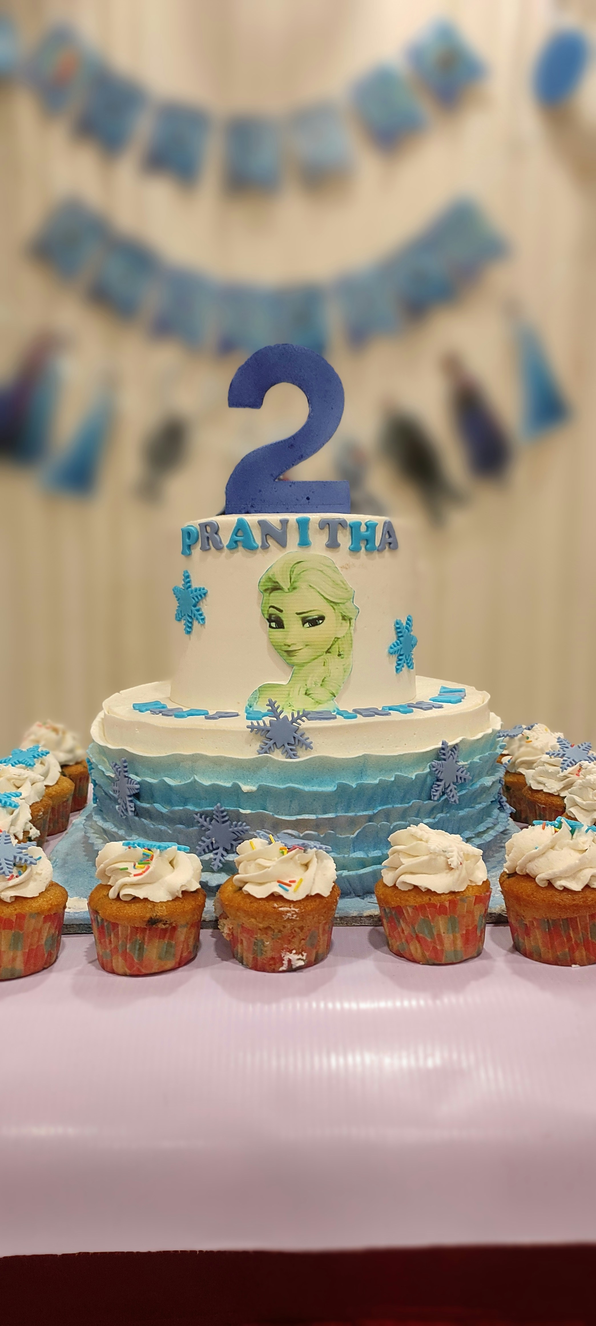 A cake with a blue frosting and a cartoon character on it photo – Free ...