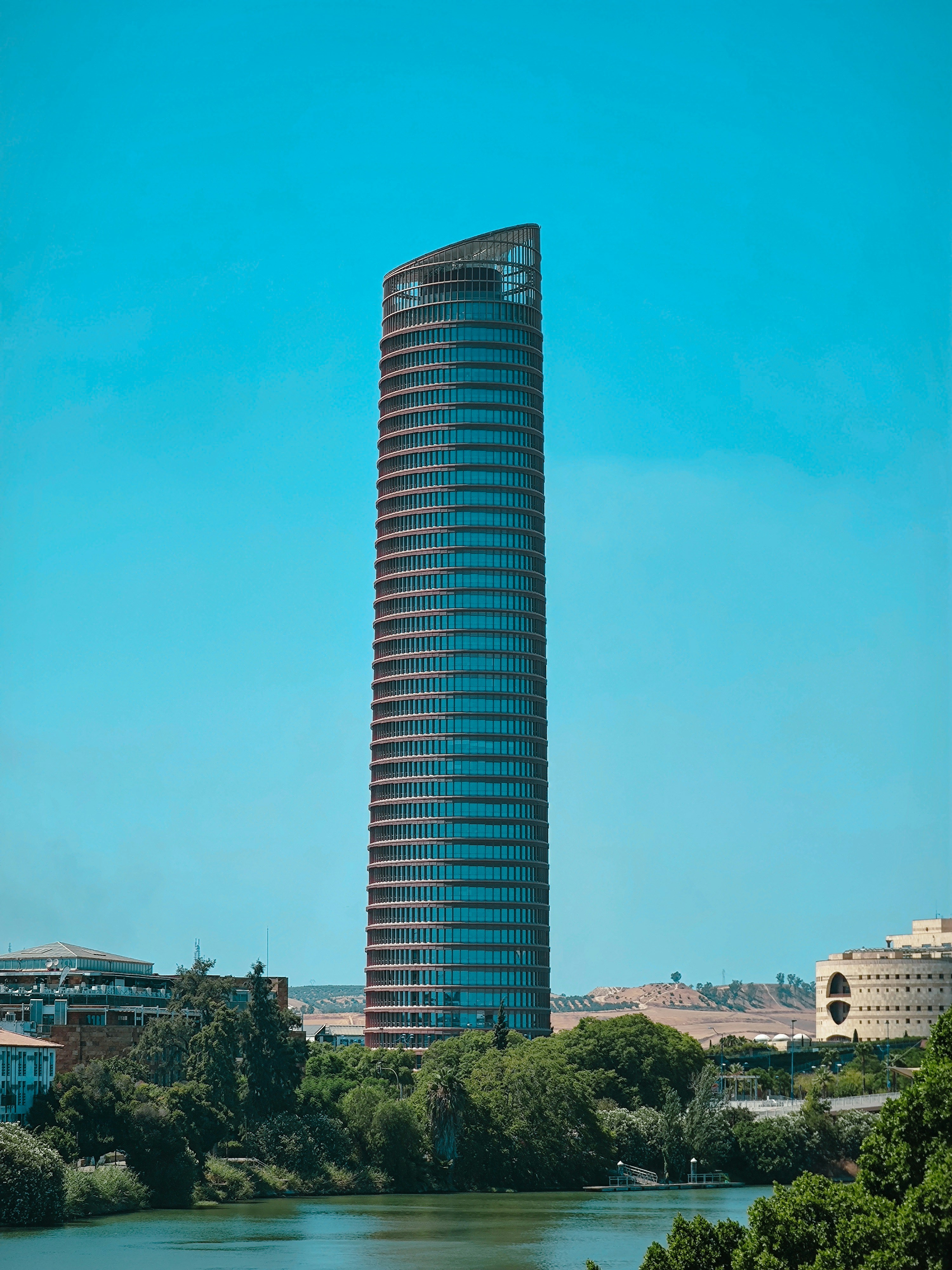 Cobalt Cylinder at River's Edge Under a Pure Blue Sky