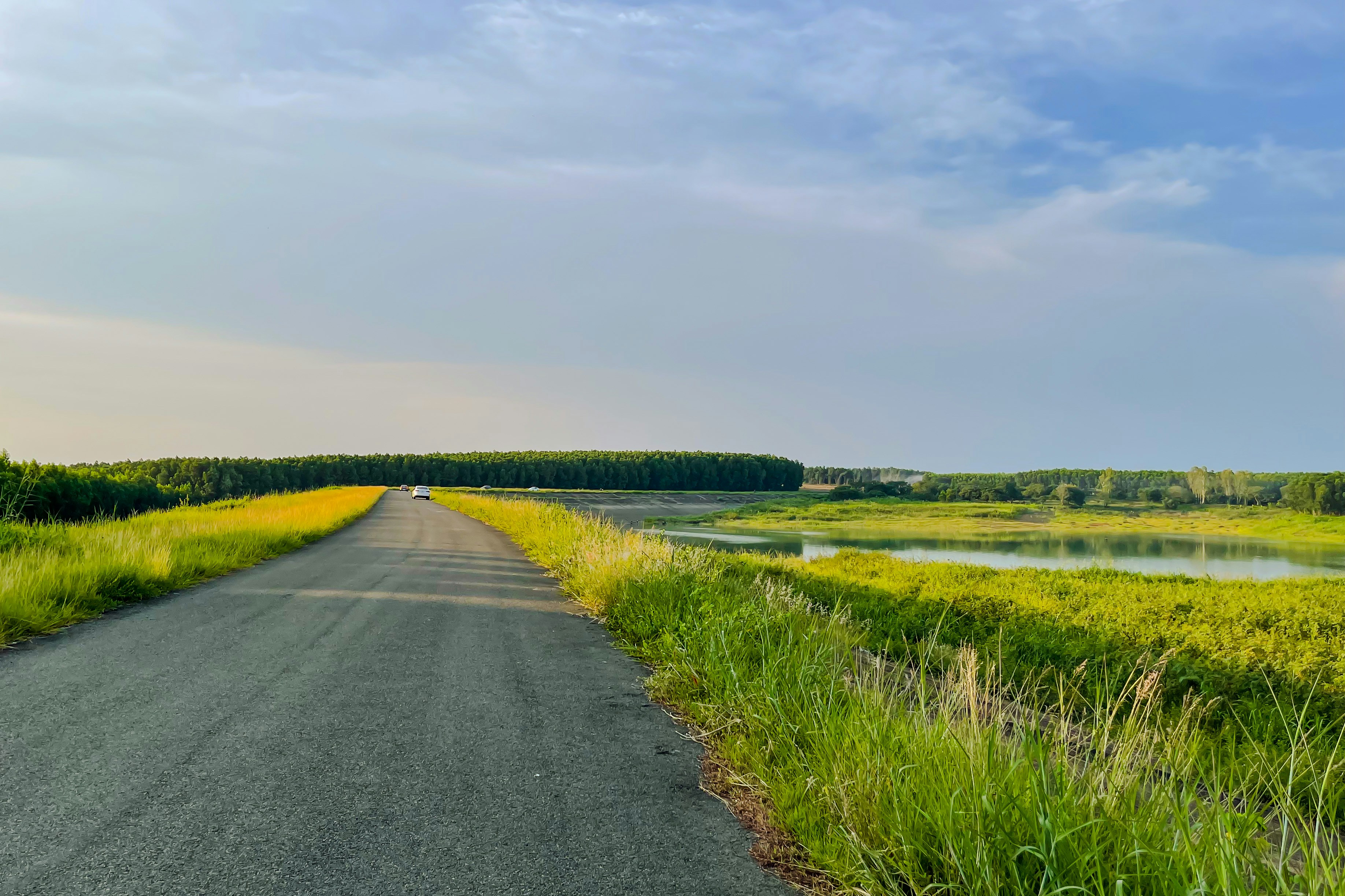 A road with grass on the side photo – Free Image on Unsplash