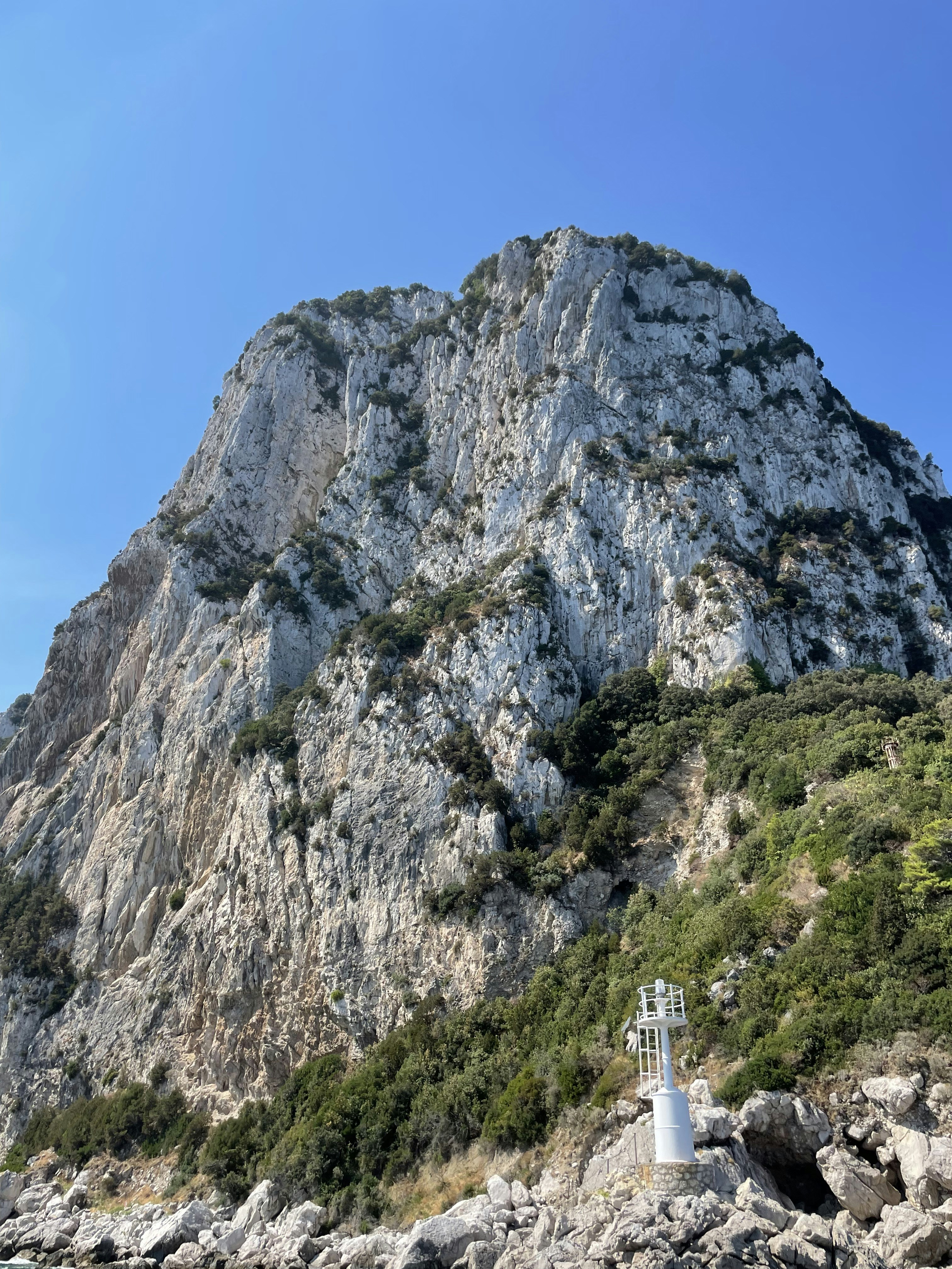 a rocky mountain with a tower