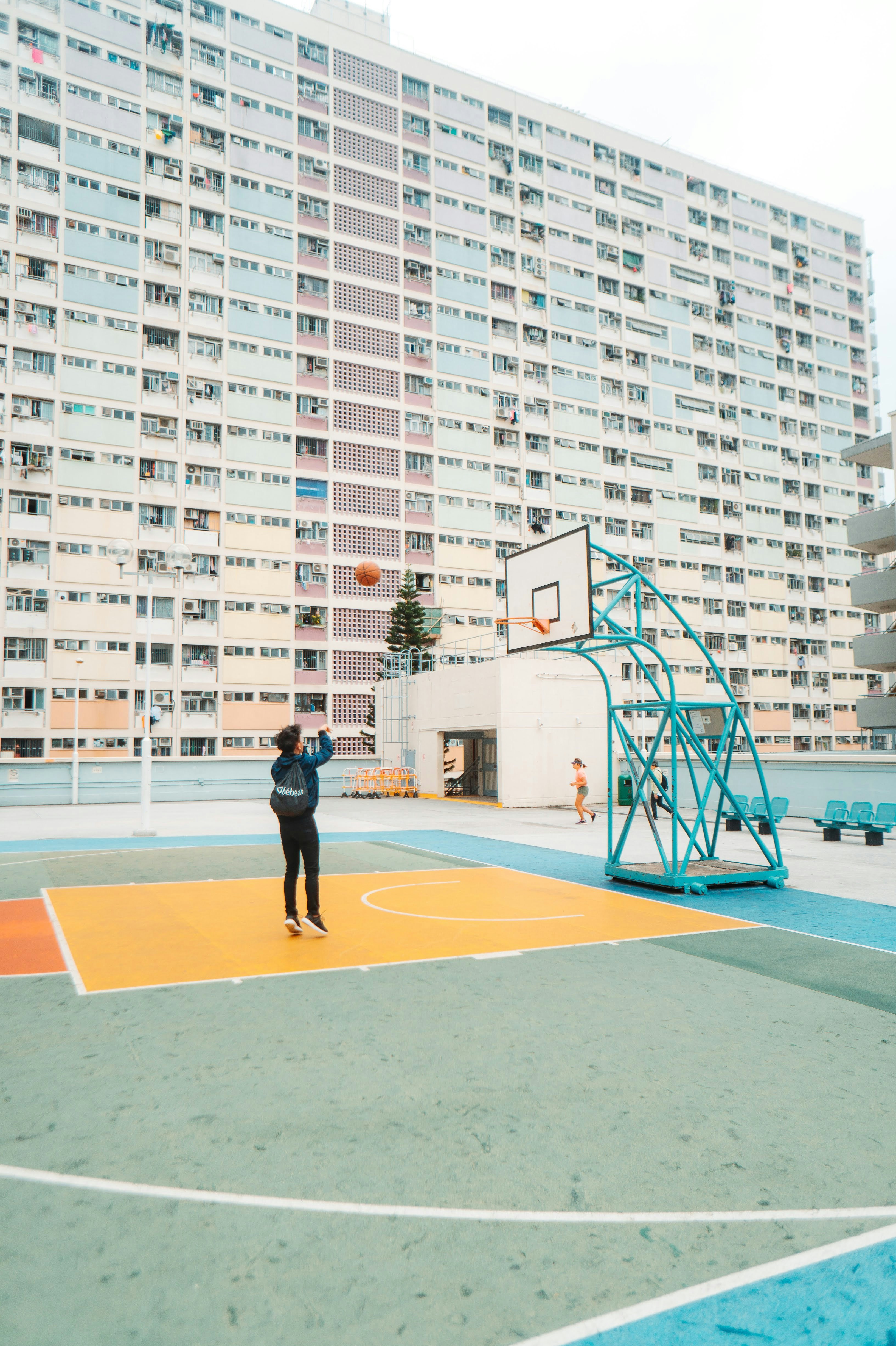 Rooftop Arc: A Player's Release Against a Panoramic City Block