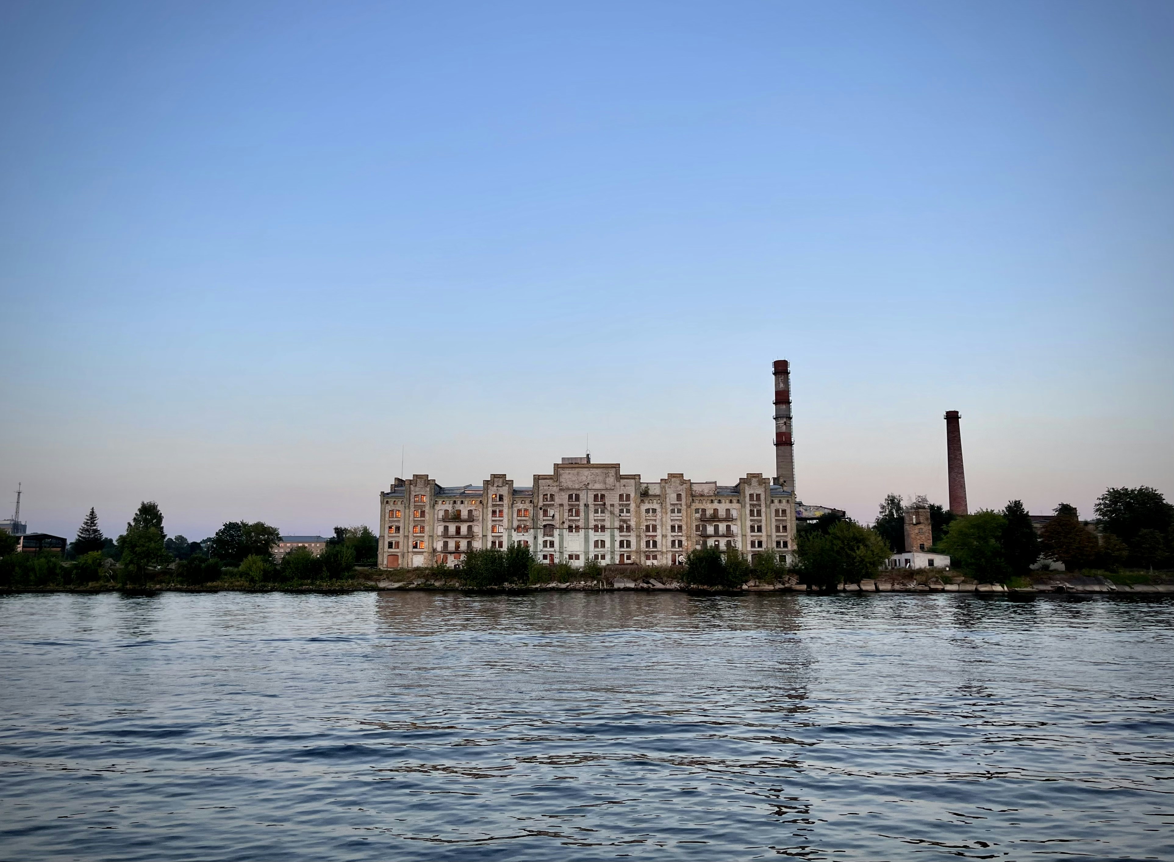abandoned building along the river near riga