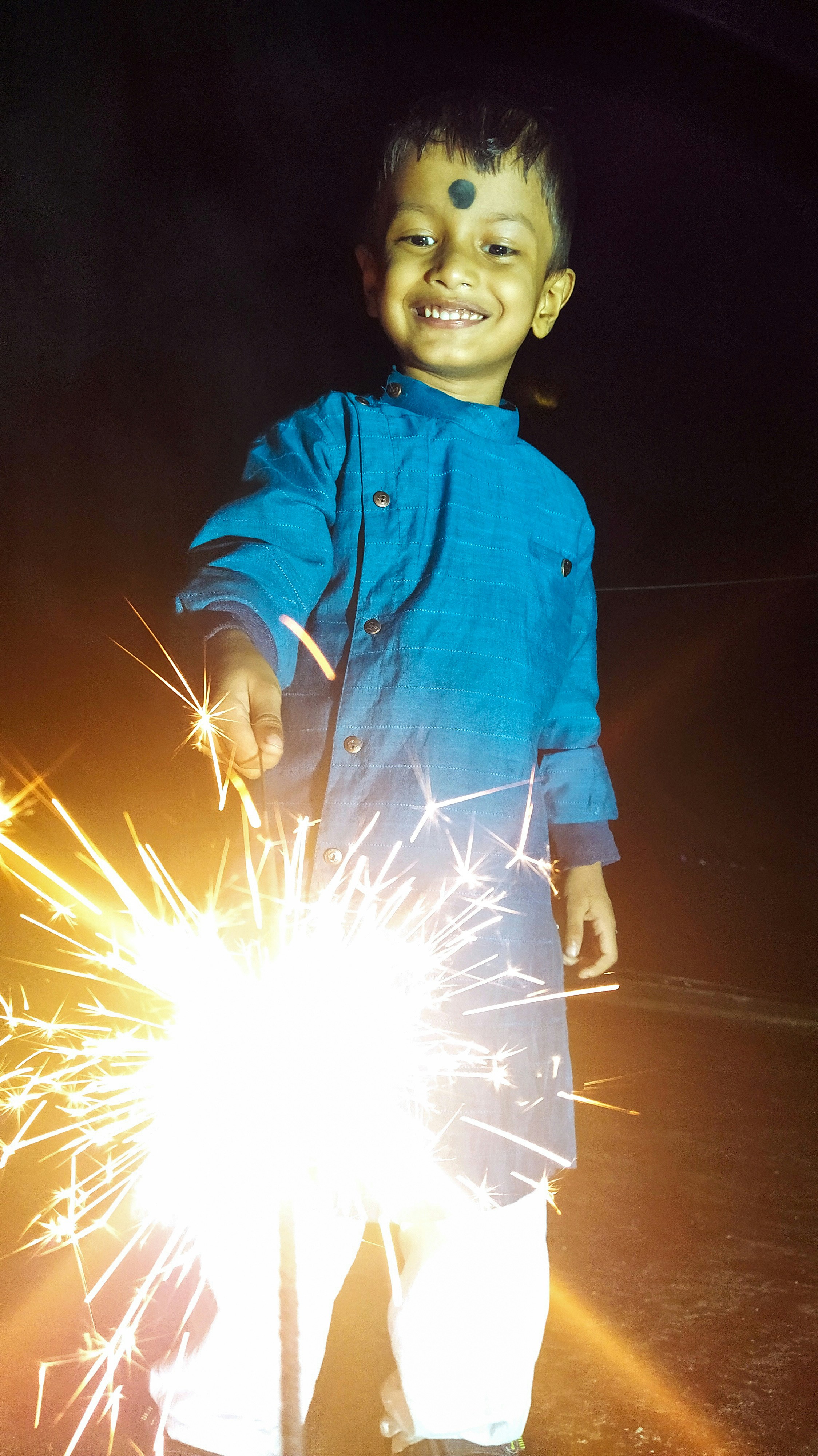 A boy standing in front of a fire photo – Free Bongaigaon district ...