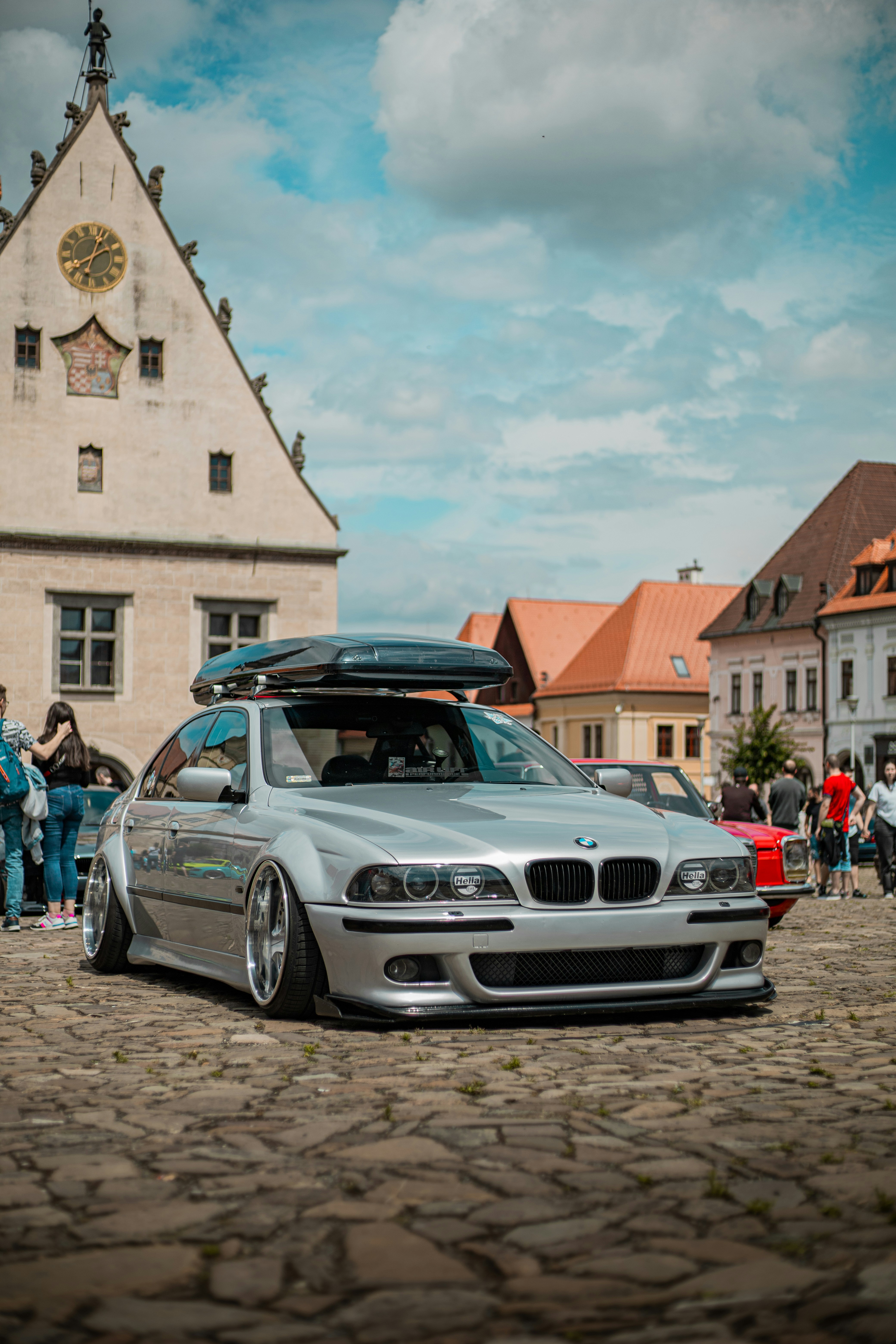 Low-Slung BMW in a Cobblestone Town Square