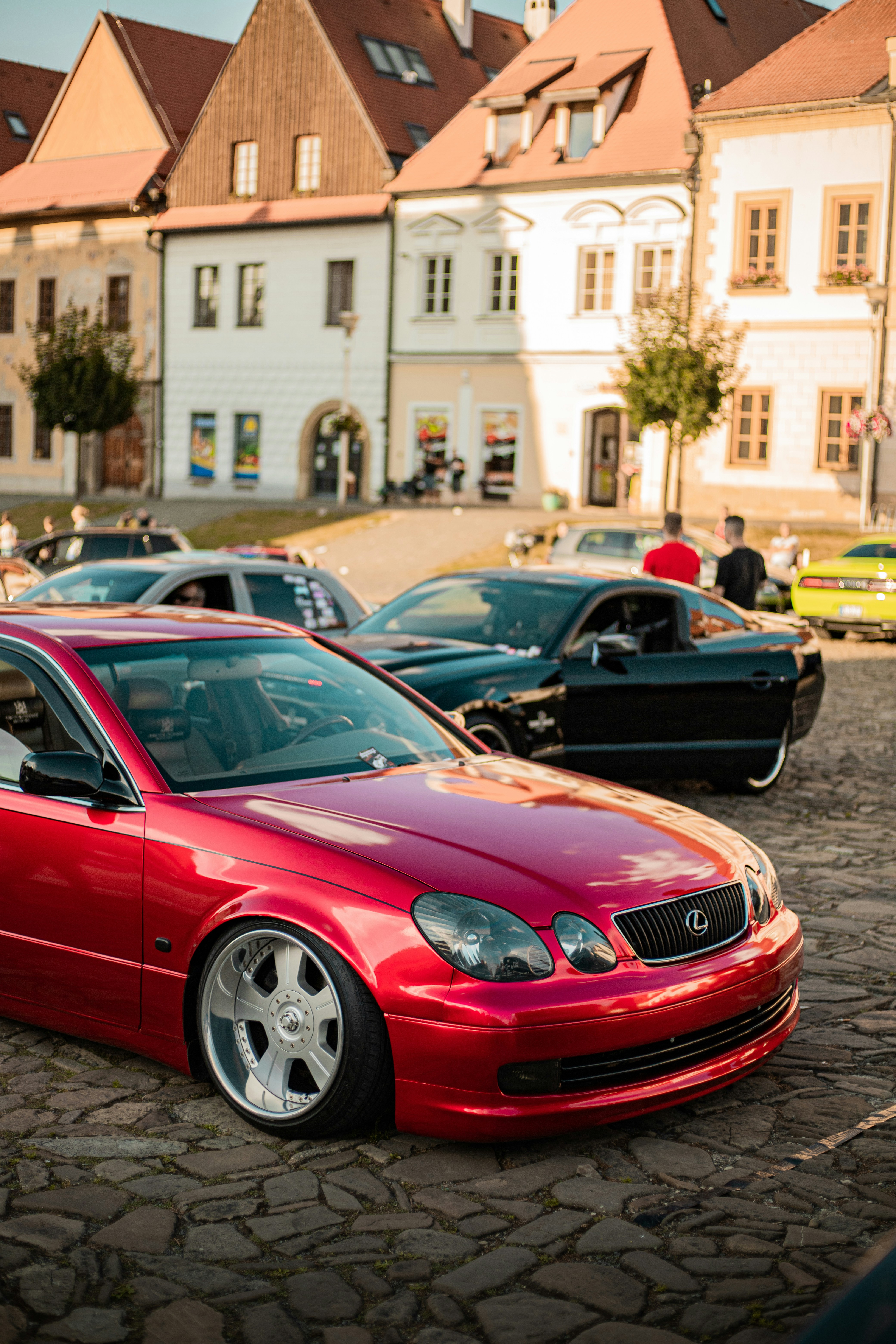 A group of cars parked in a parking lot photo – Free Car Image on Unsplash