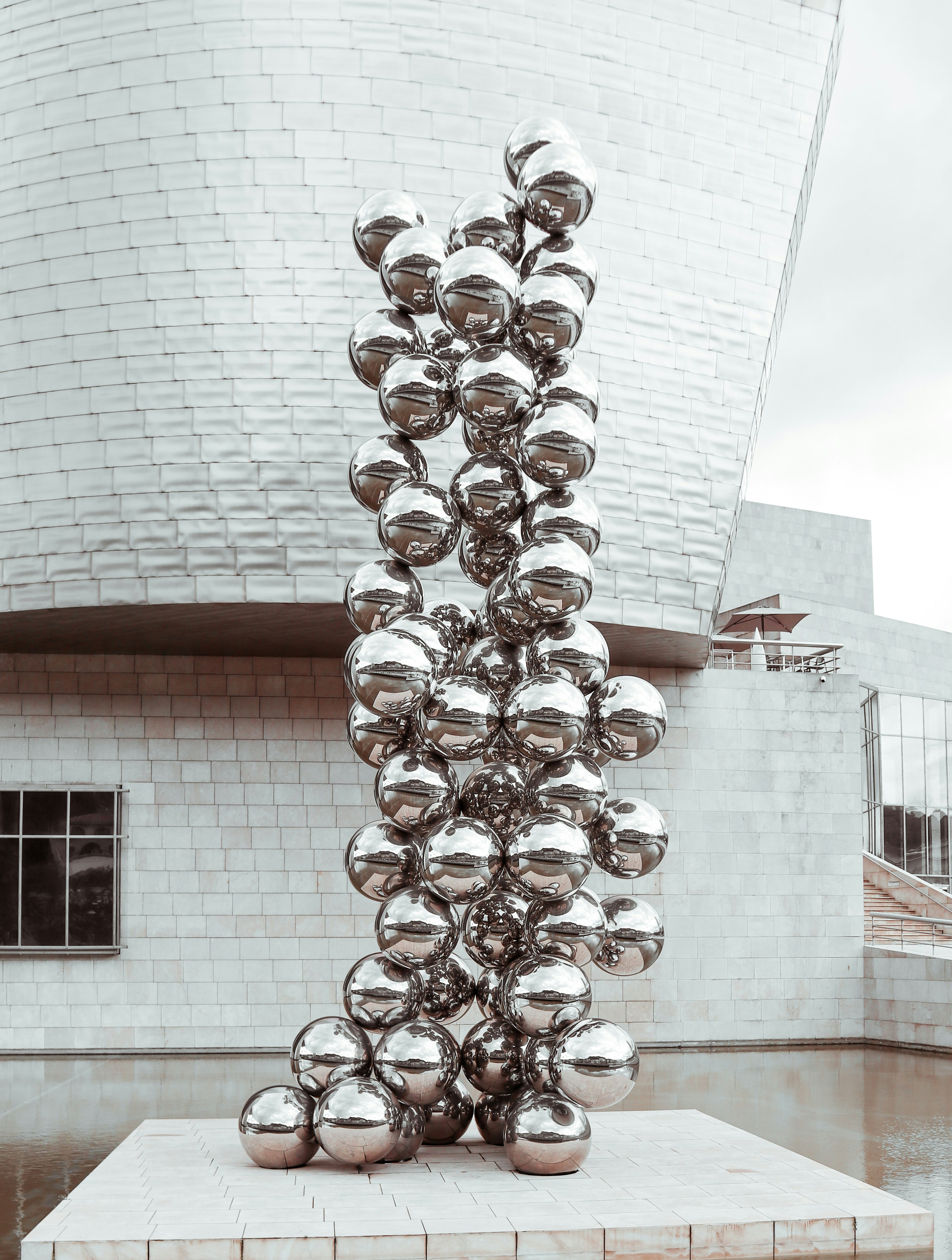 Sculpted Echoes: Reflective Orbs in a Modern Courtyard