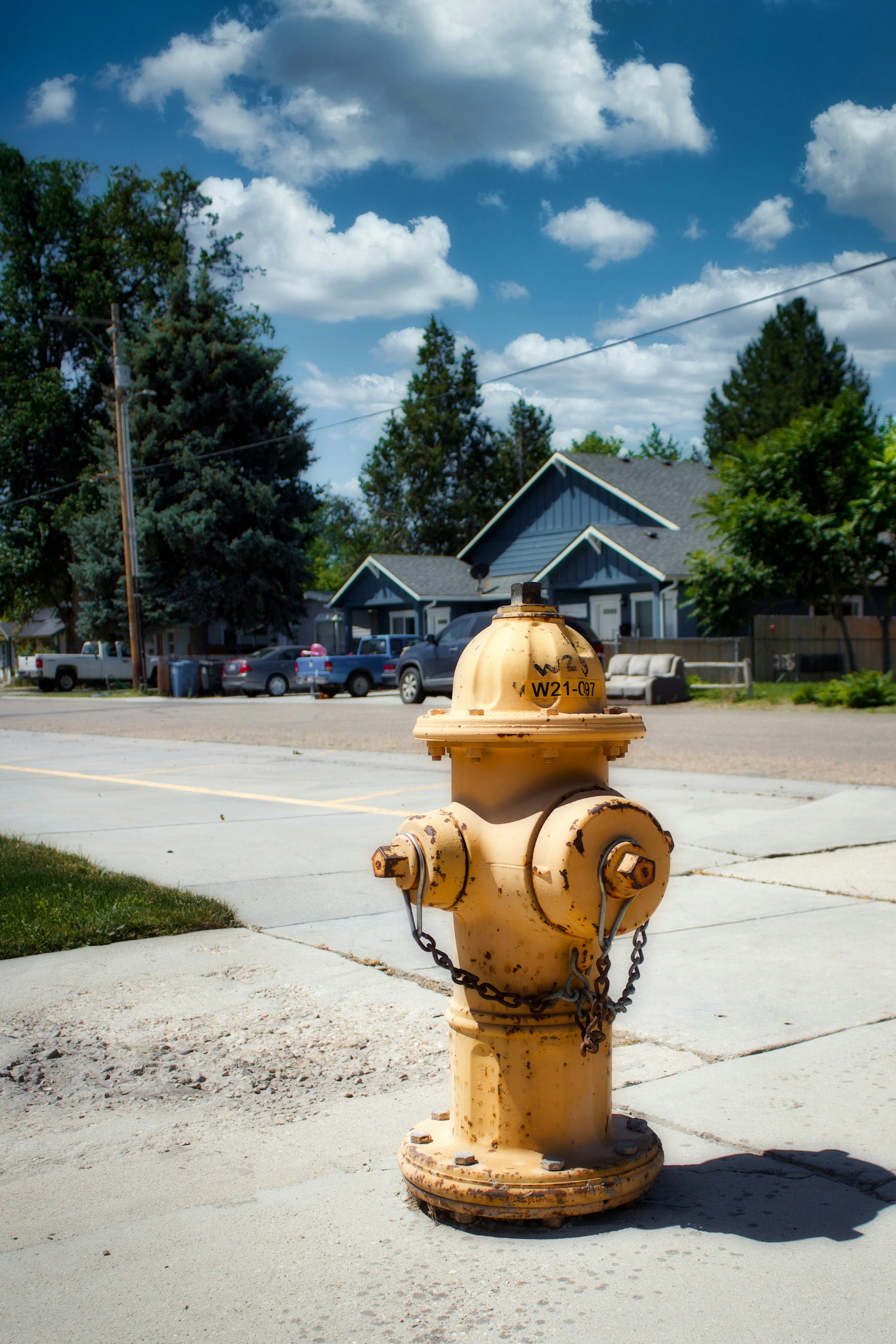 A yellow fire hydrant on the side of the road photo – Free Car Image on ...