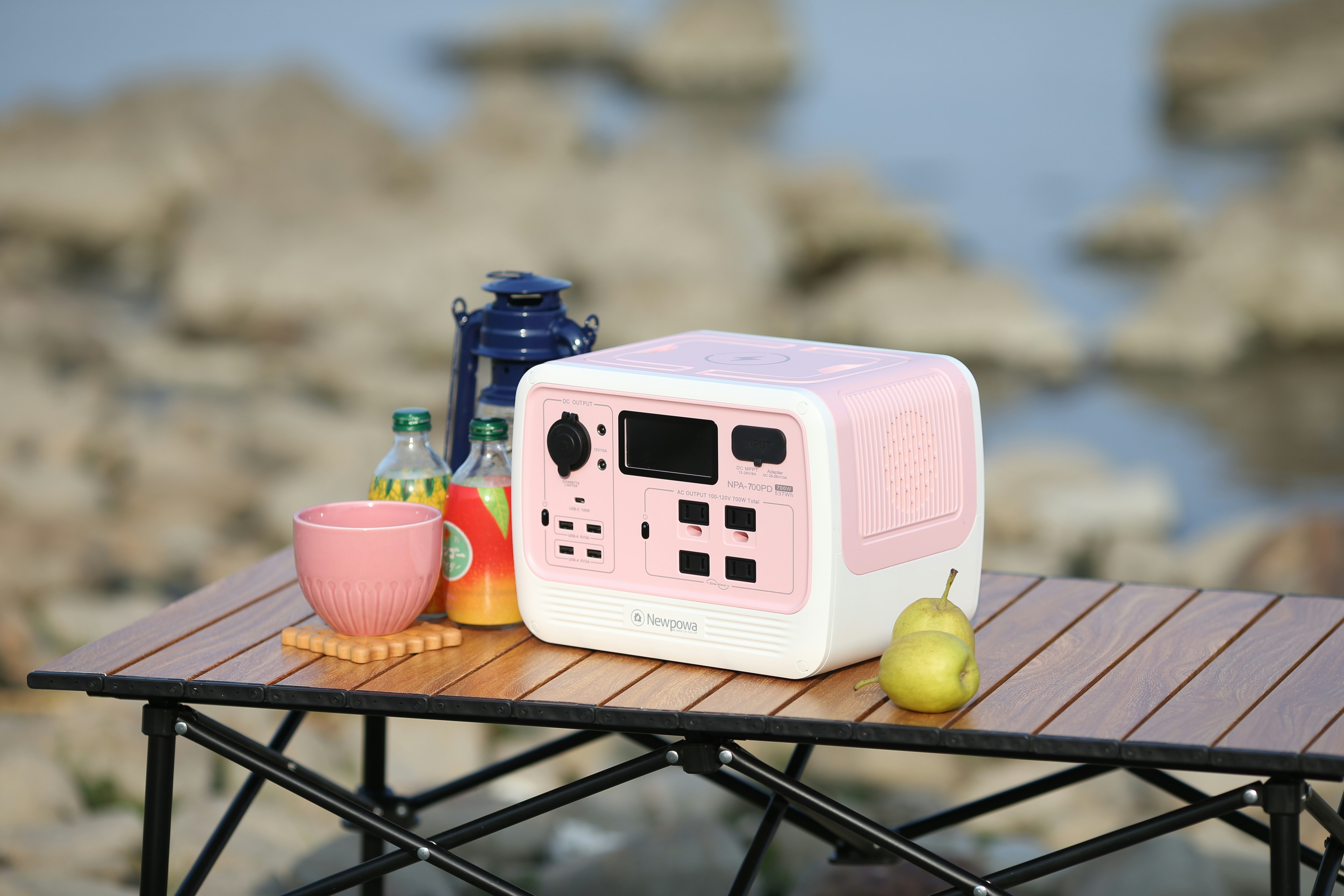 a table with a small pink and white machine on it