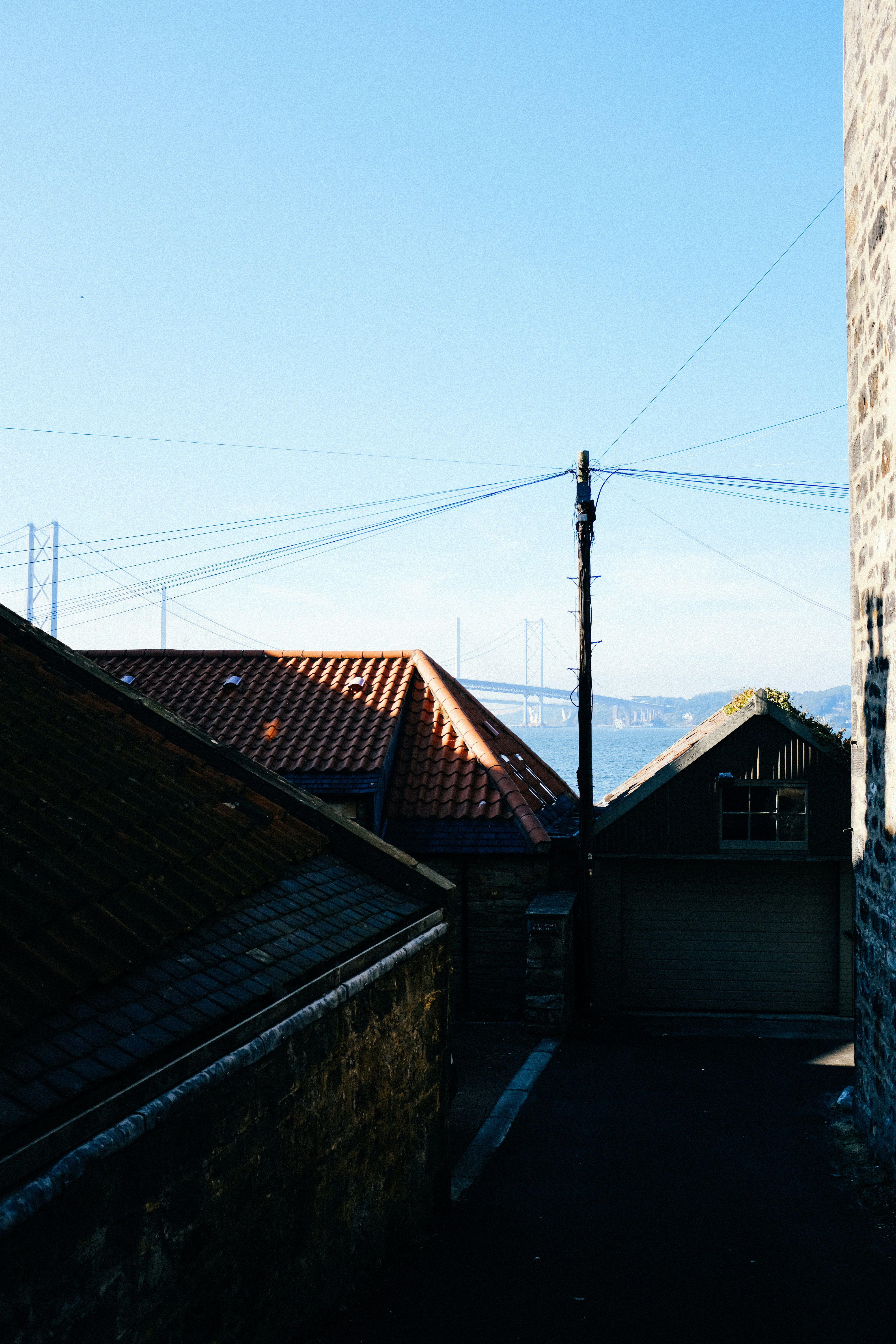 A row of buildings with power lines photo – Free Blue Image on Unsplash