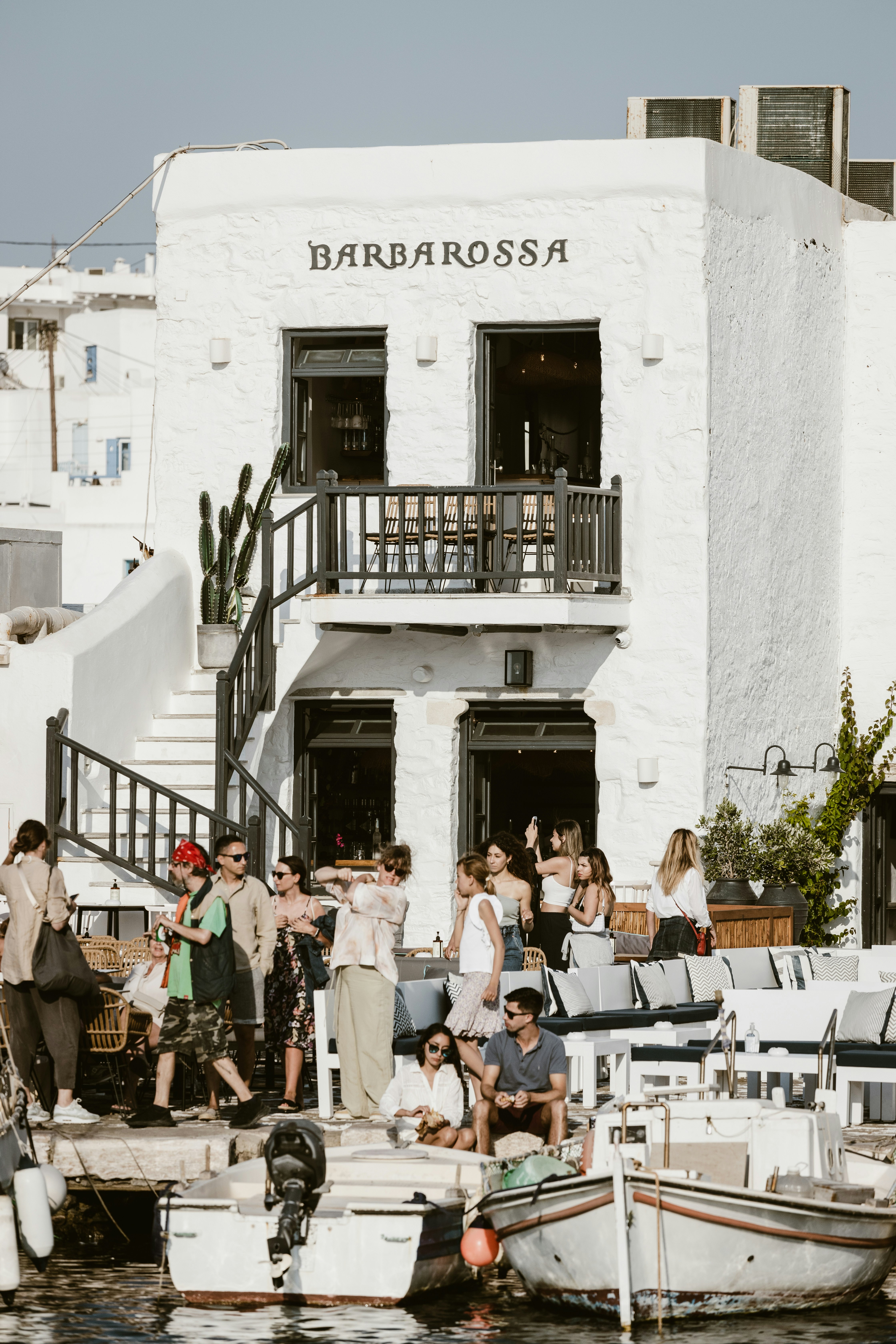 A group of people standing outside a building photo – Free Greece Image ...