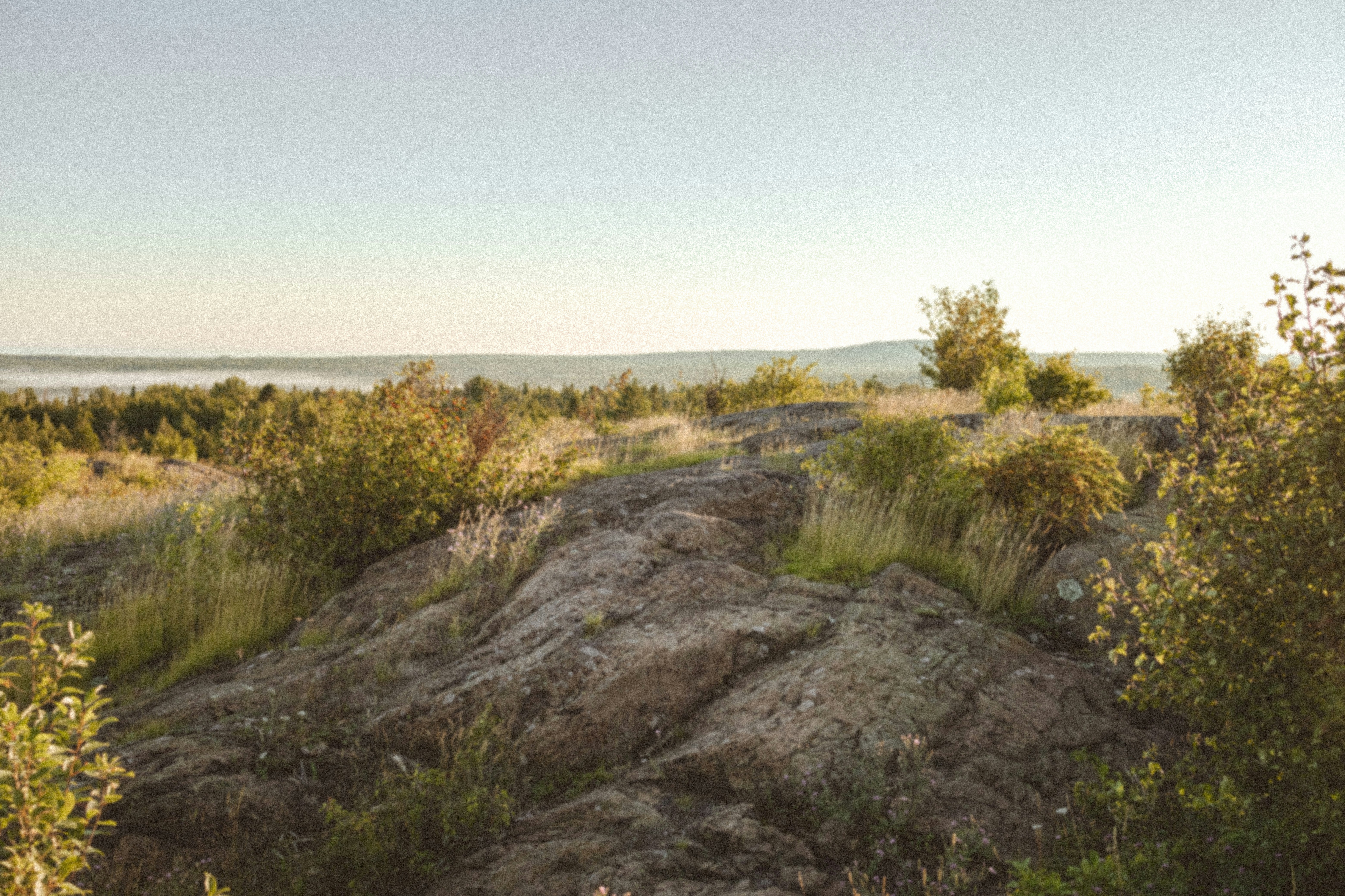 Granite Ridge at Dawn: A Quiet Trail to the Distant Lake