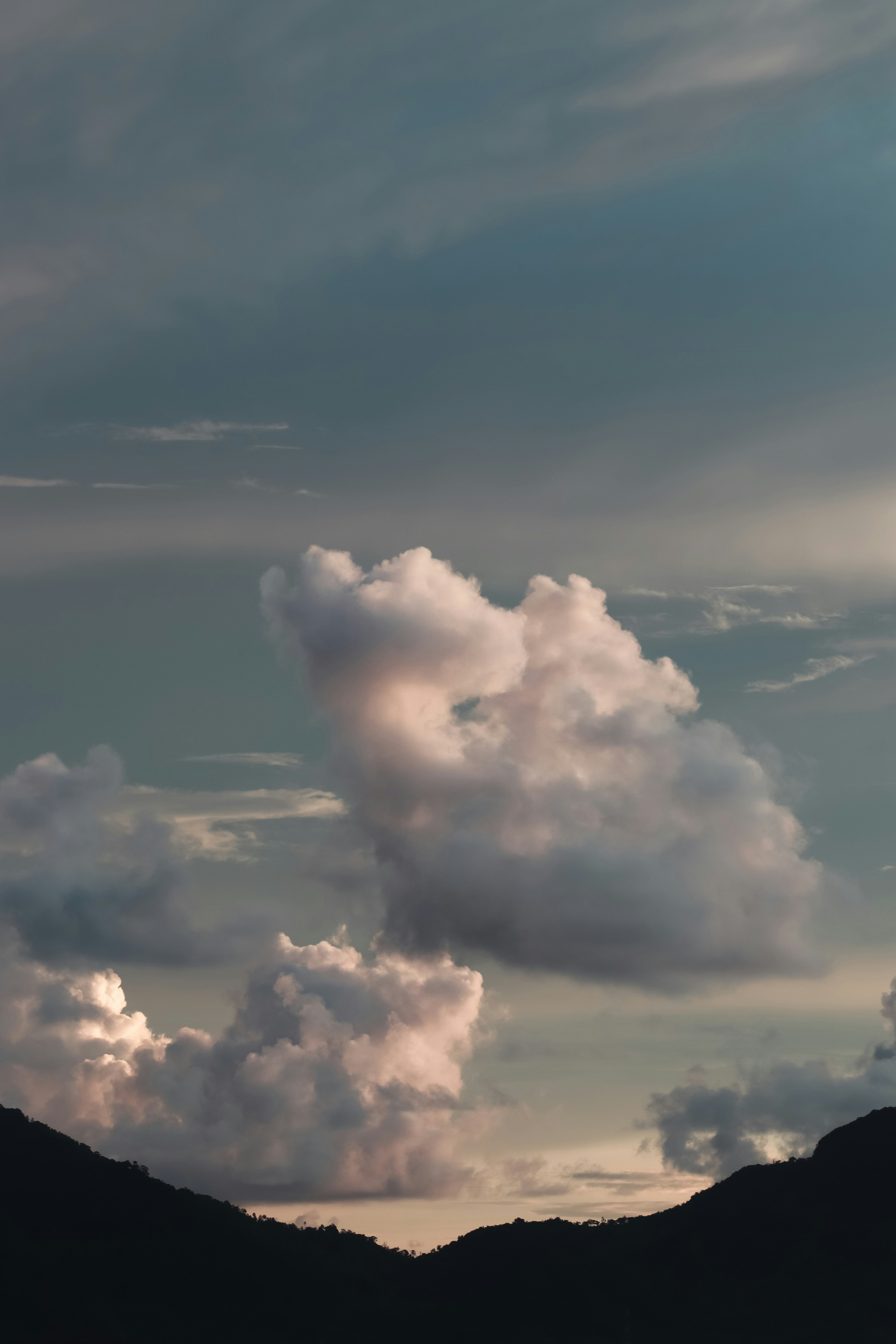 Vertical Choir Over the Quiet Mountain Rim at Dusk