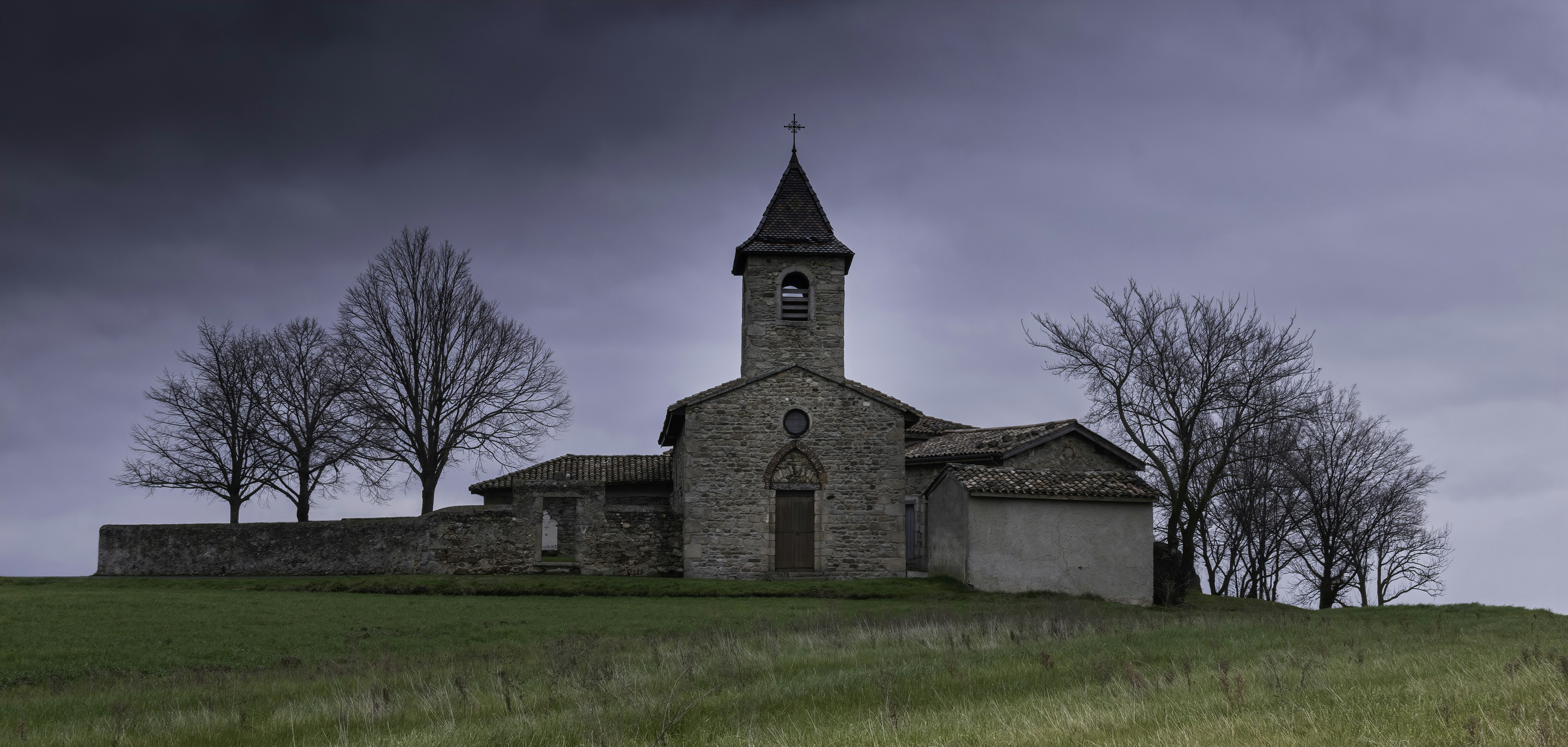 Solitary Church Under Stormy Skies