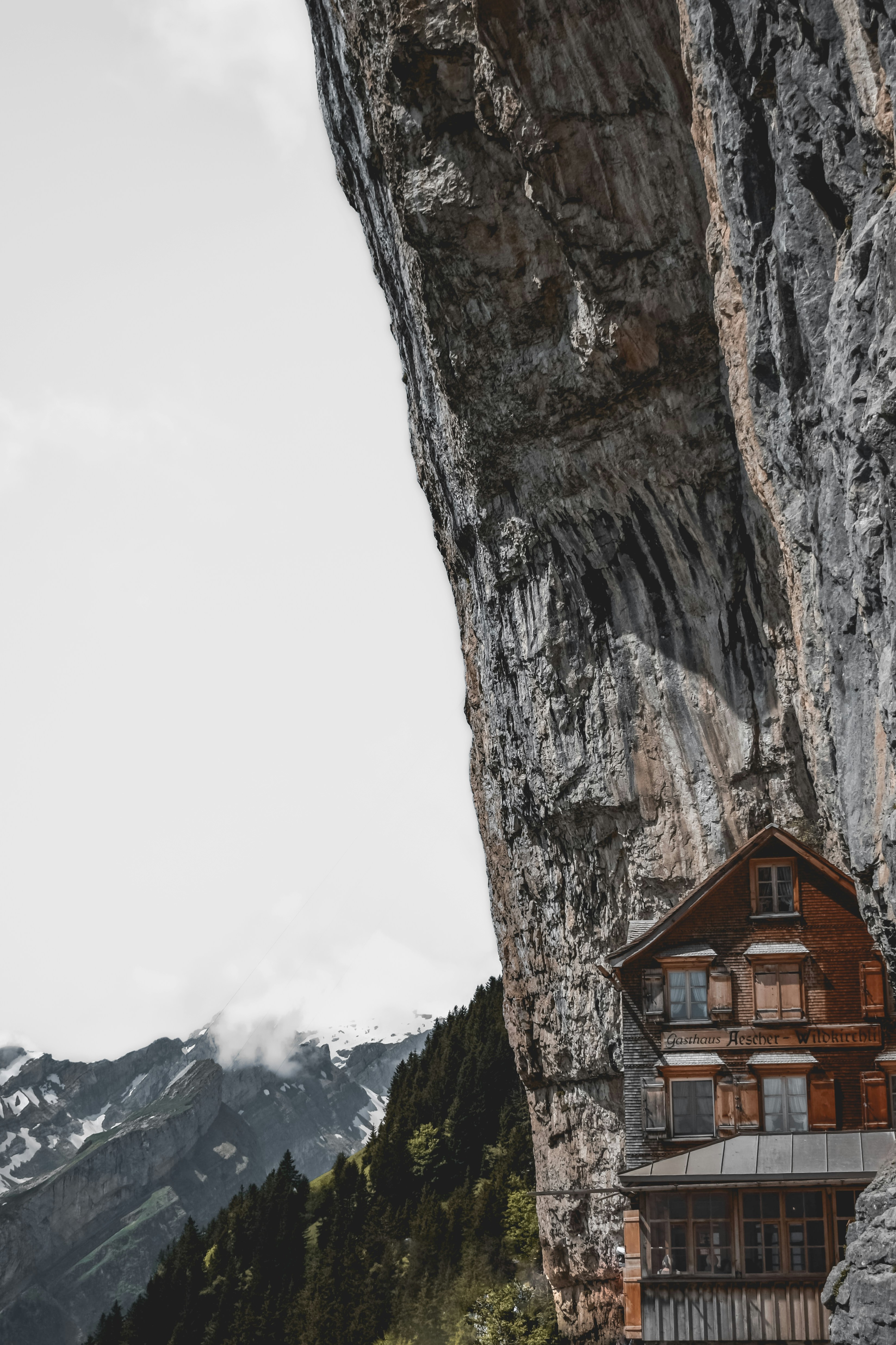 A building on a cliff photo – Free Blue Image on Unsplash