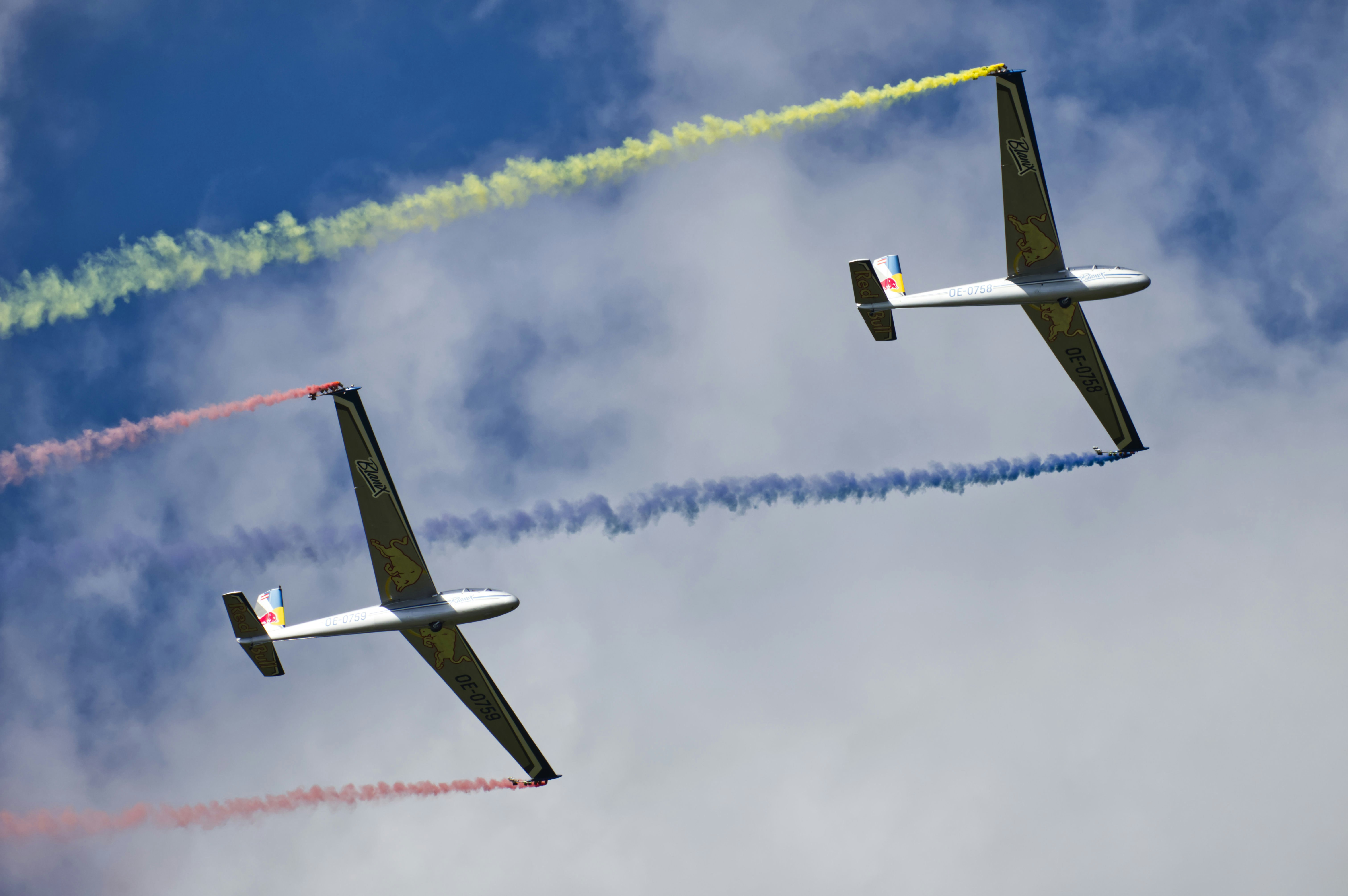 Two Foam-painted Wings Cut Through Sky: Aerial Smoke Trails in Parallel