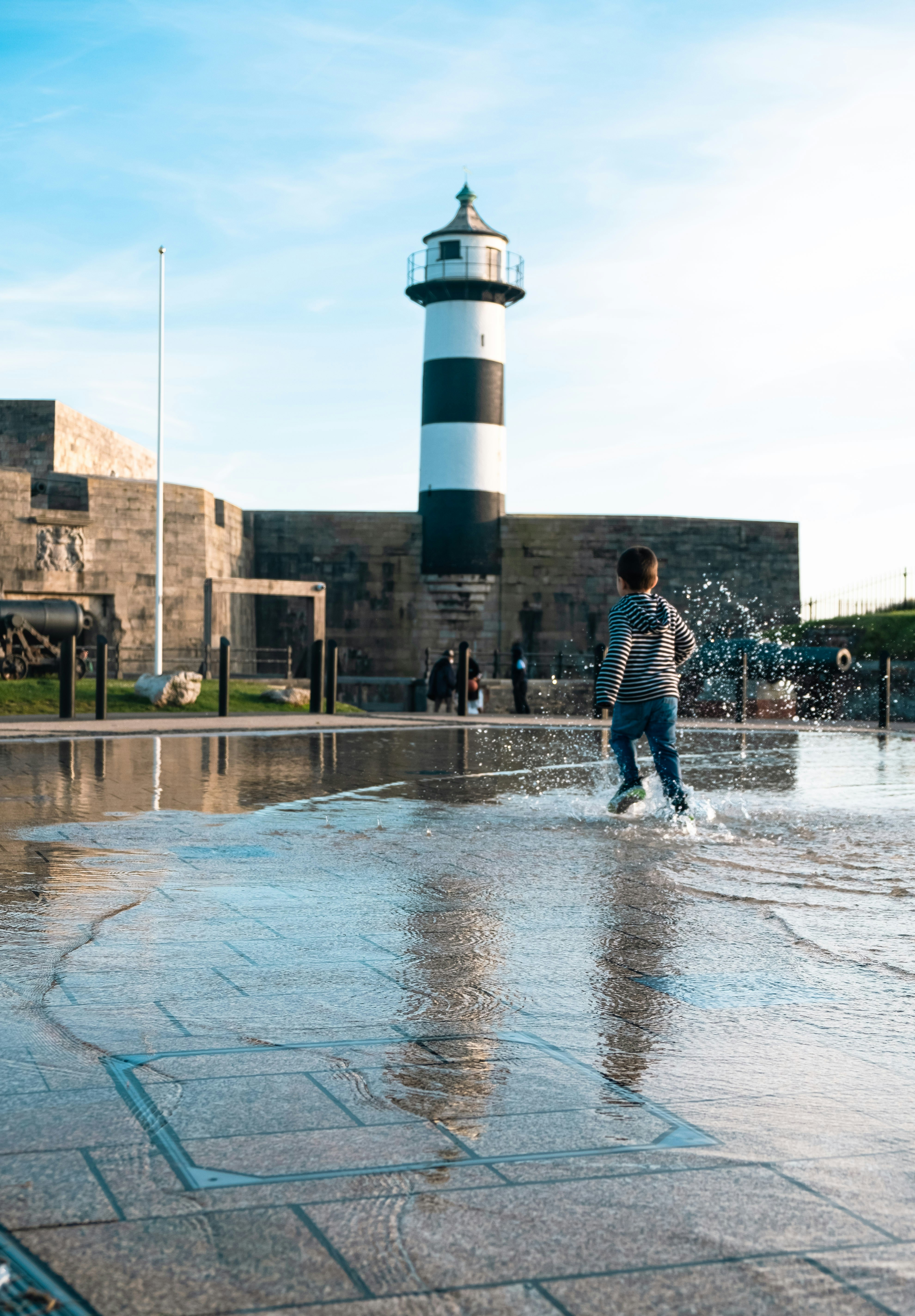 Stride and Spray by the Striped Lighthouse