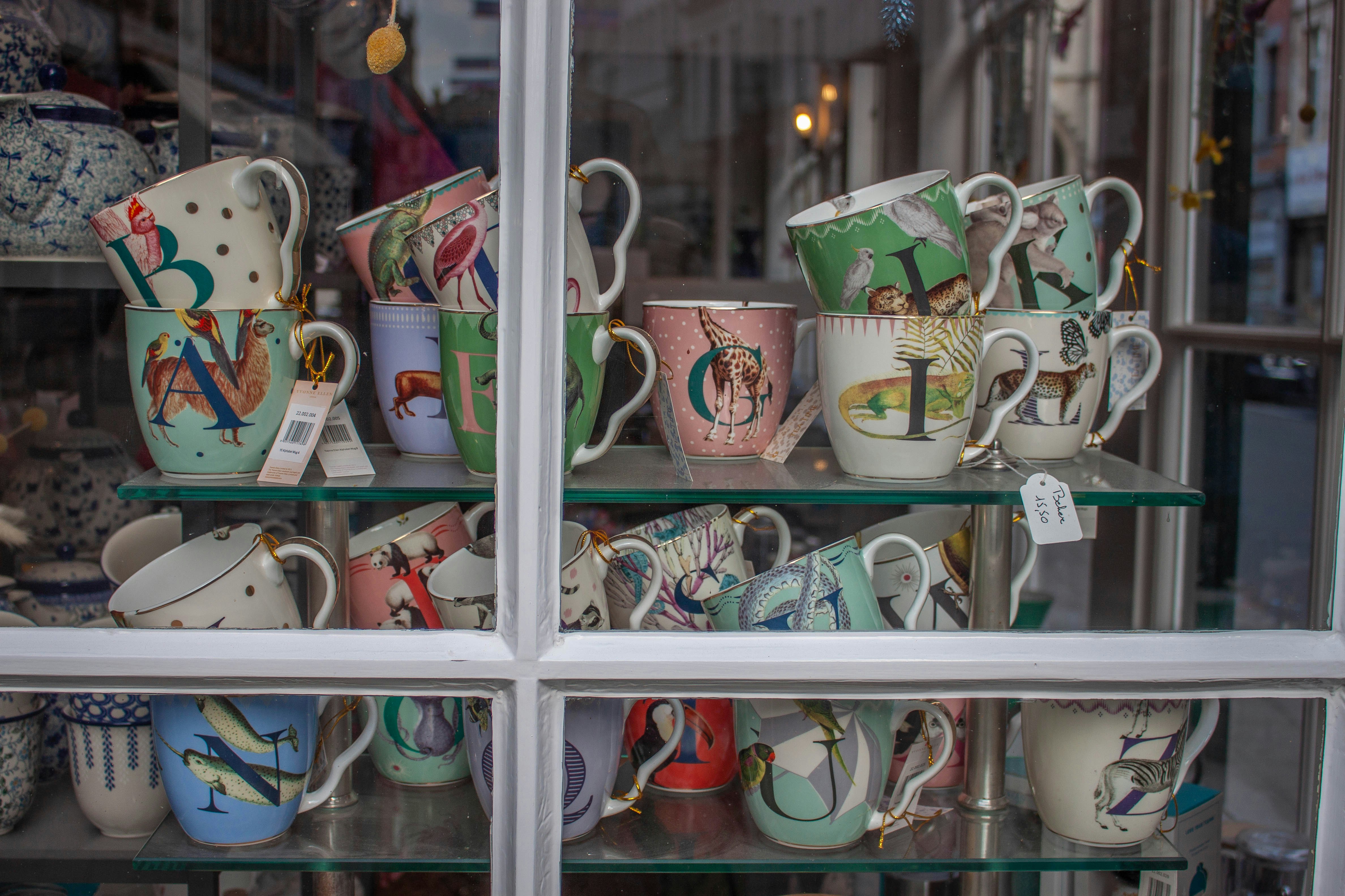 Pastel Palette in Glass: Mugs Arranged in a Window Display