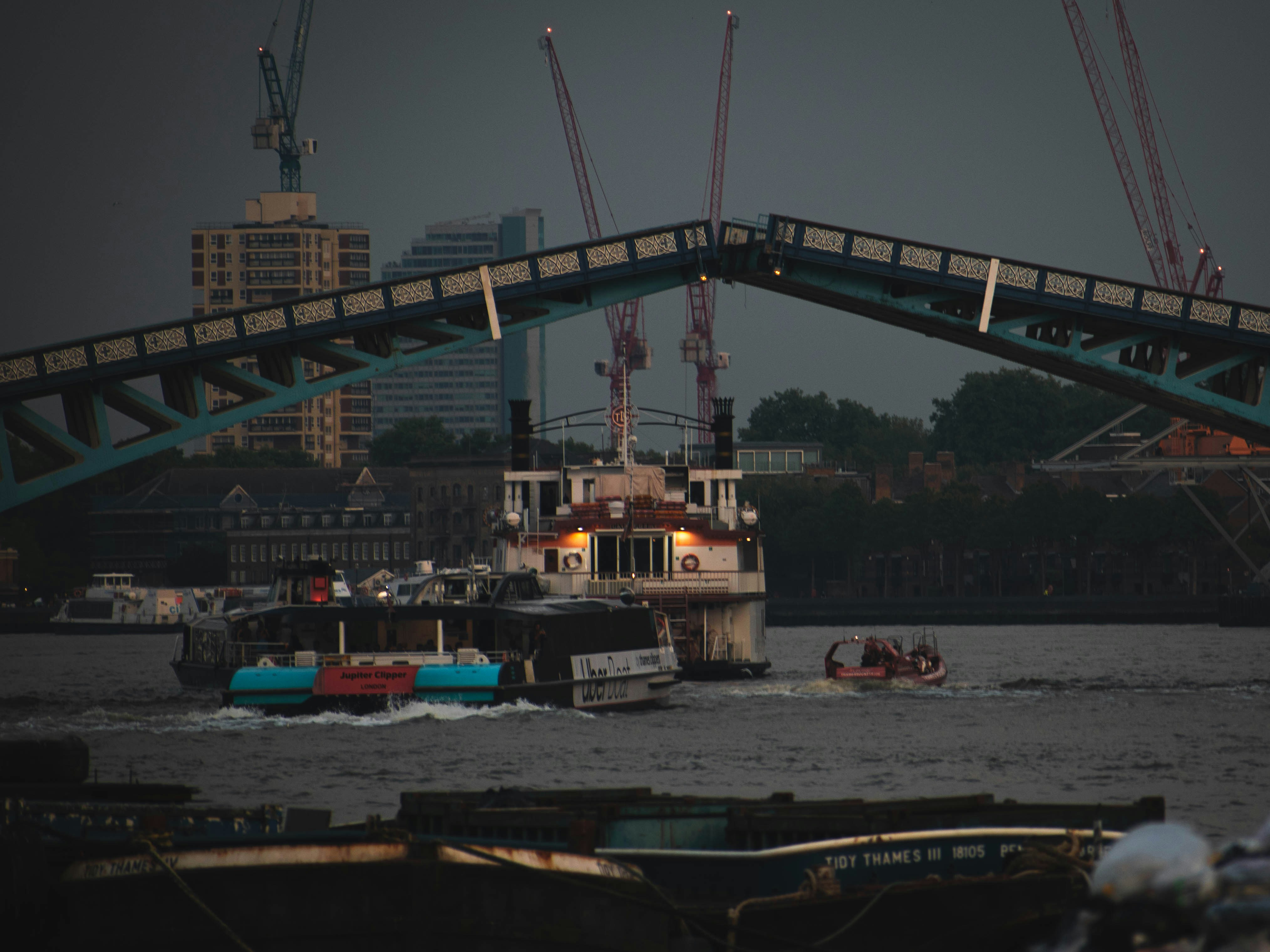 Midnight Passage: Barges Under the Thames Lift Bridge and Crane Skyline