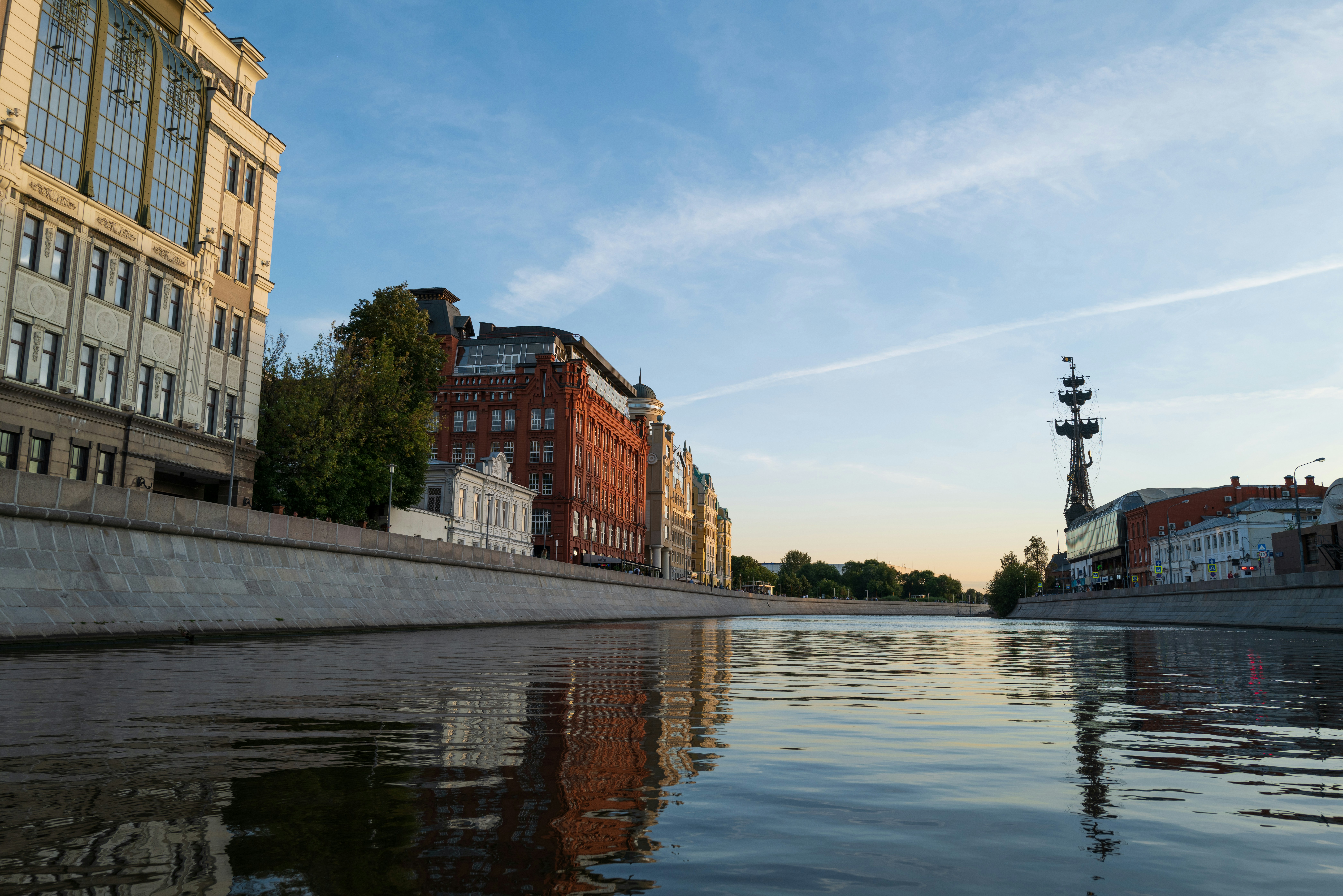 Riverside Reflections: A Low-Angle Portrait of Stone, Water, and a Monument