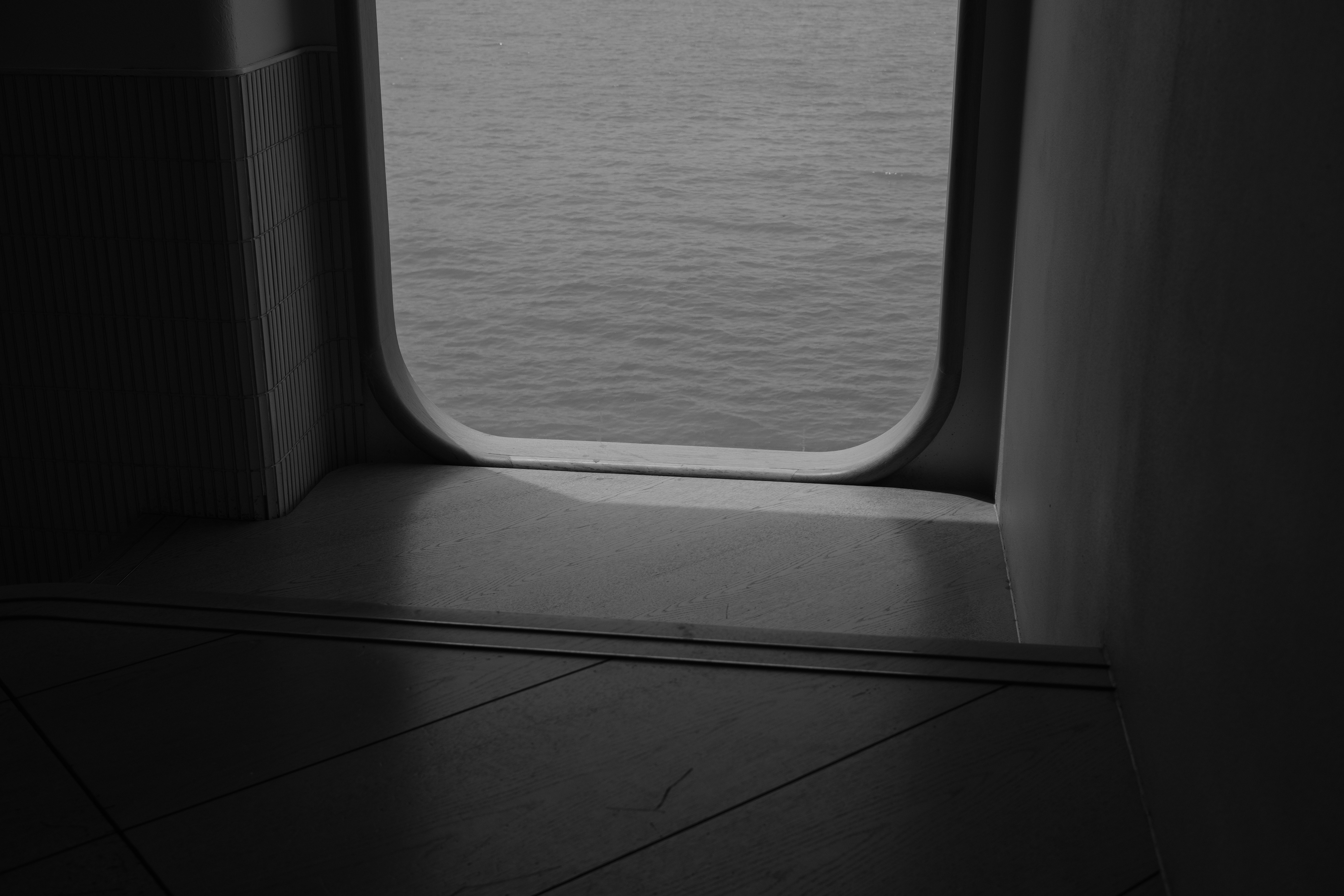 Monochrome Window to the Sea: Quiet Horizon from a Cabin