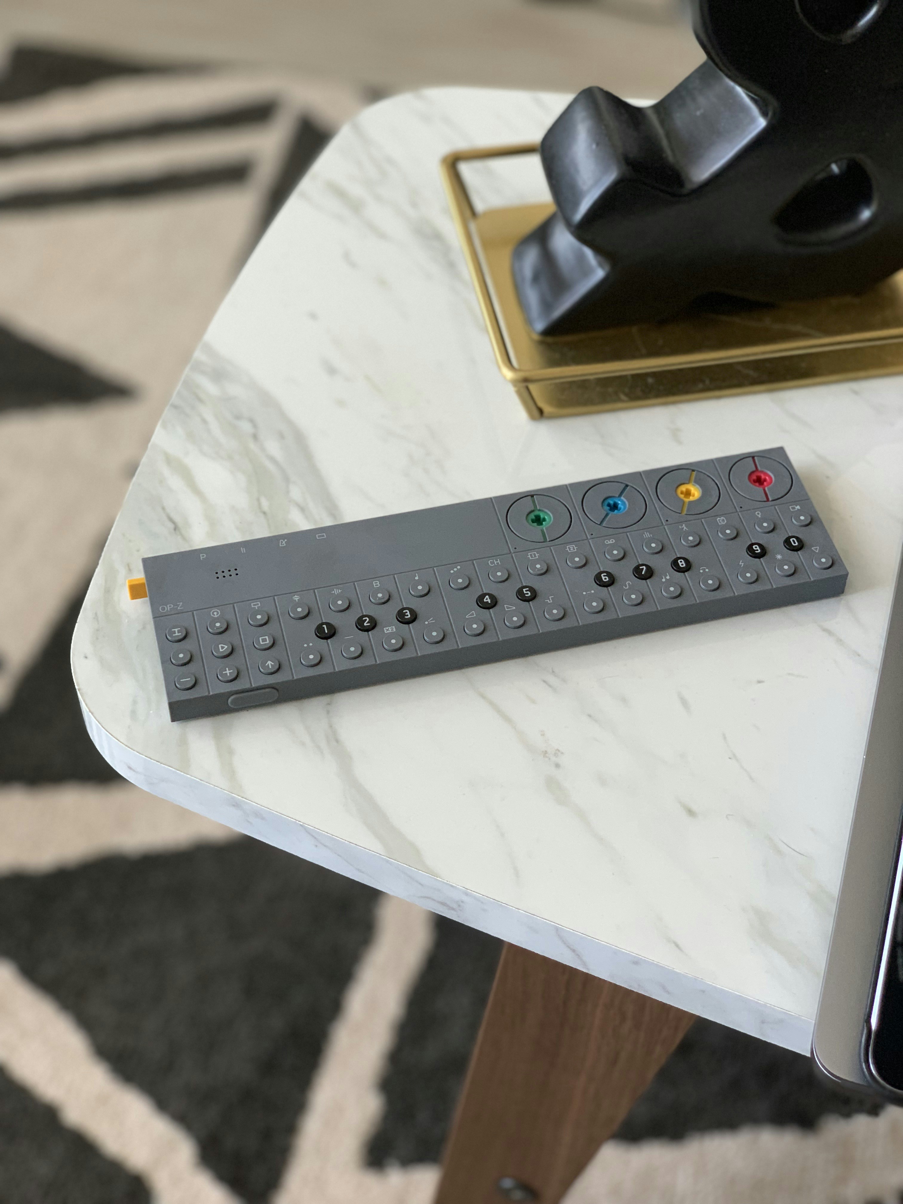 Grey Button Panel on Marble Table: A Quiet Minimalist Moment