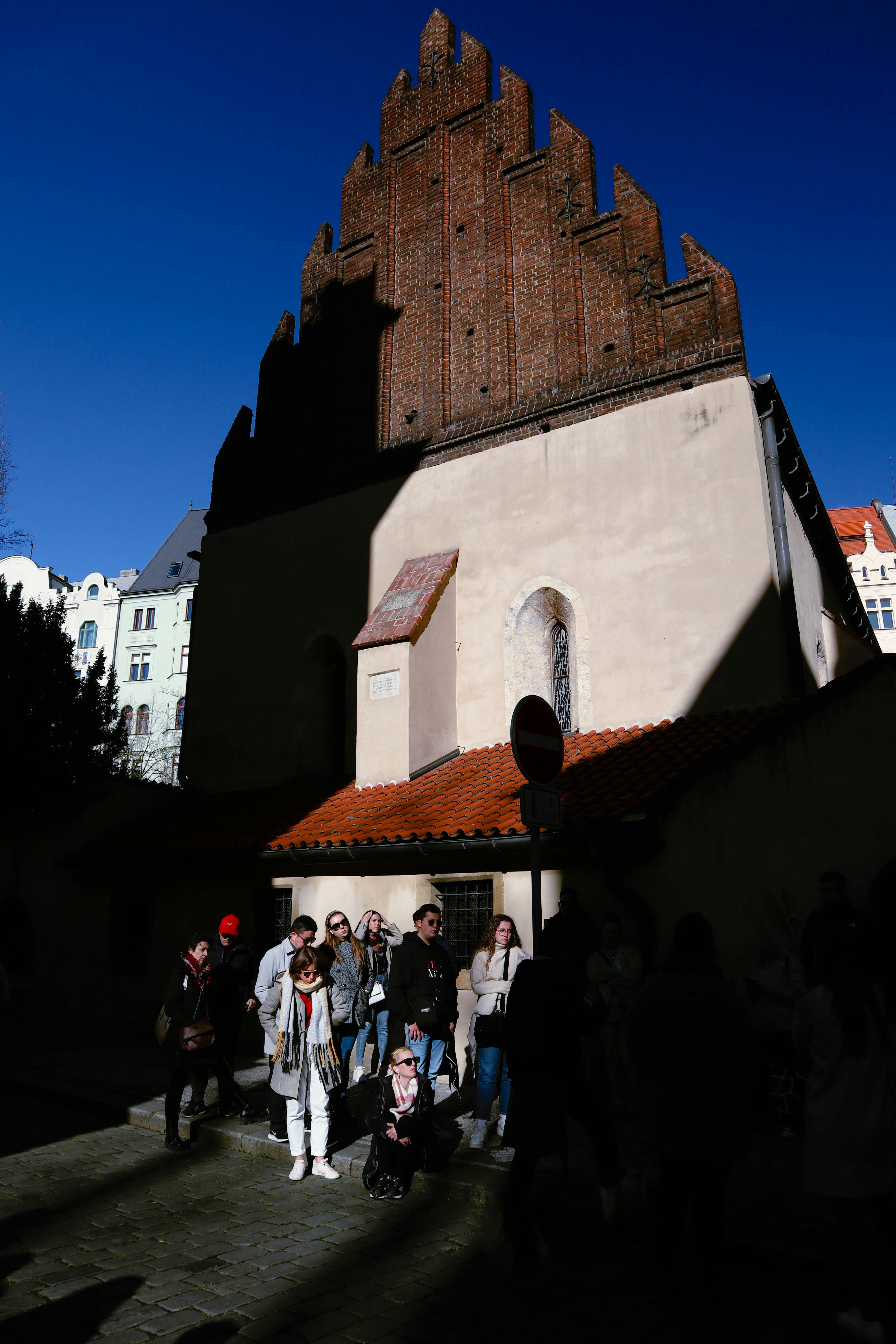 A group of people outside a building photo – Free Prague Image on Unsplash