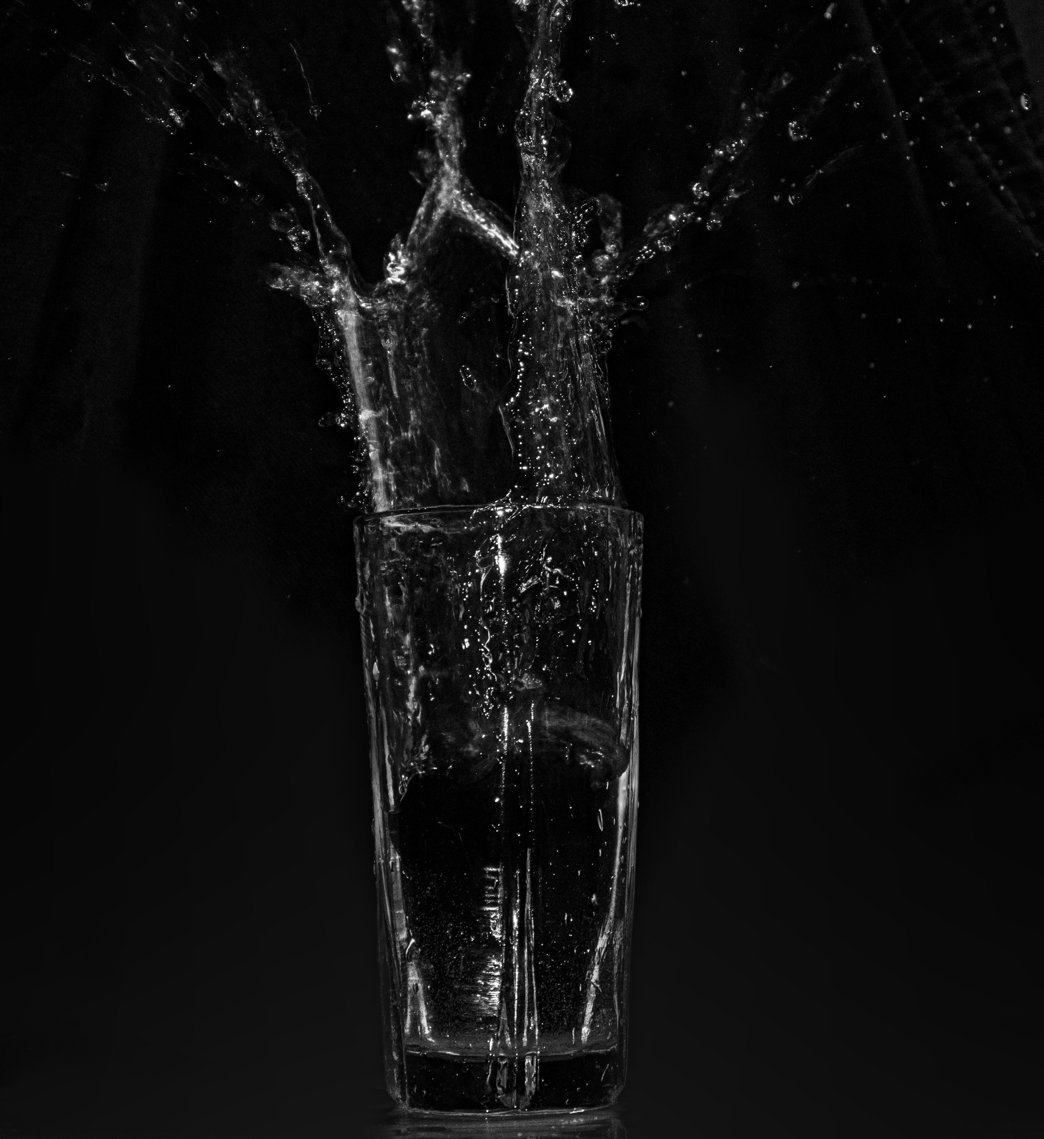 A glass of water with water splashing out of it photo – Free Splash ...