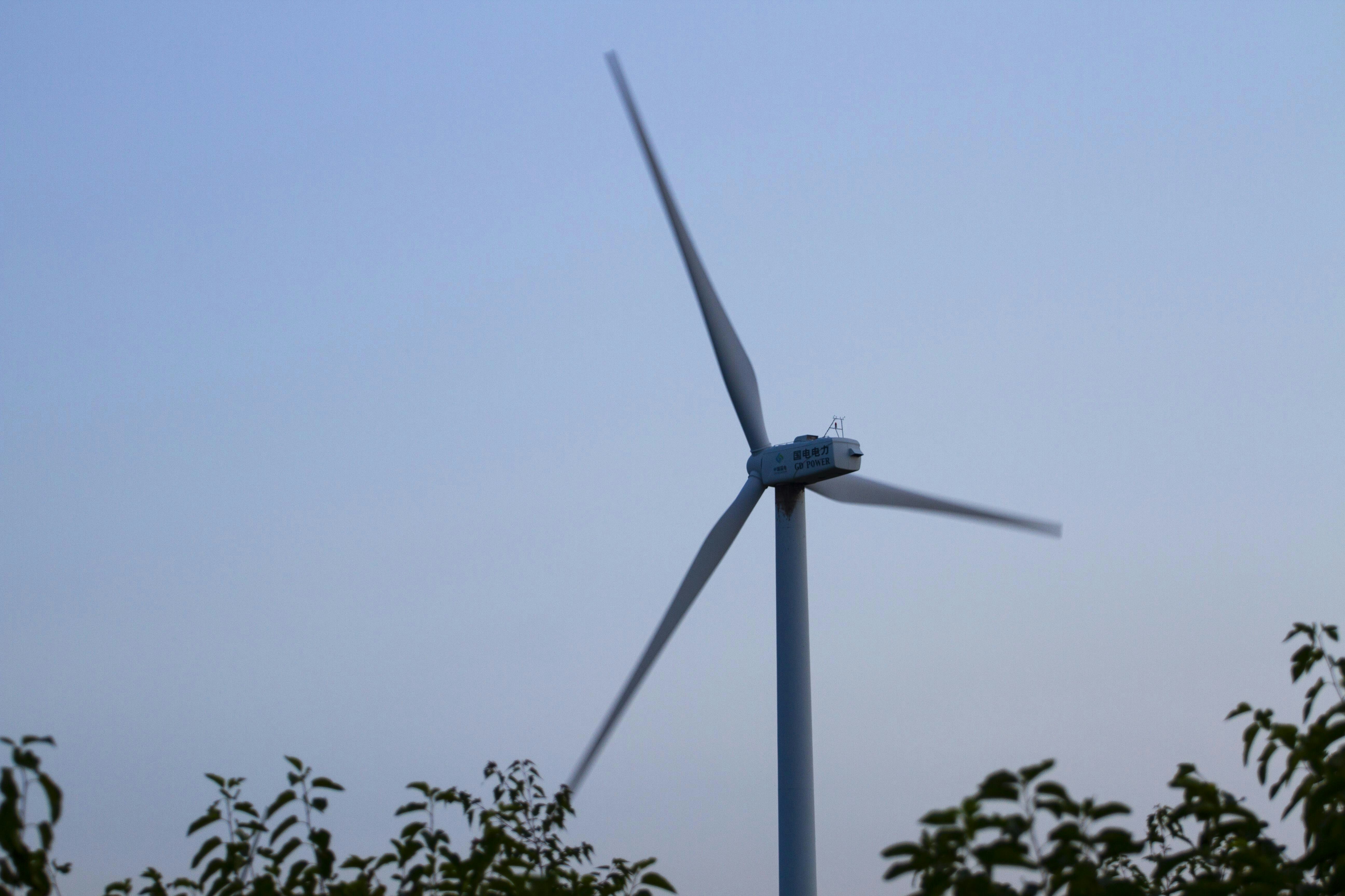 Hub Against the Blue: A Wind Turbine with Blades in Soft Spin