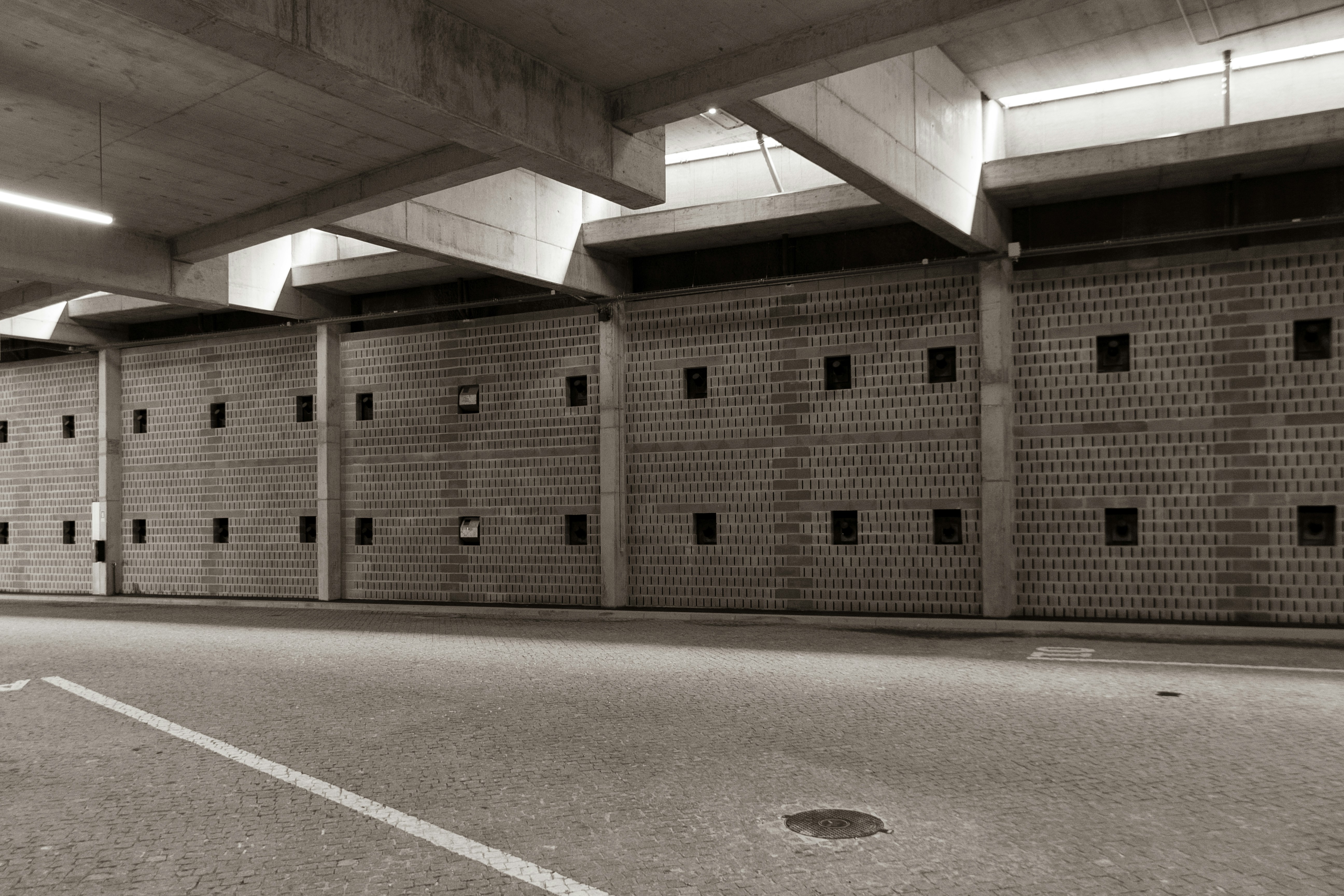 Concrete Echoes: An Empty Garage Corridor