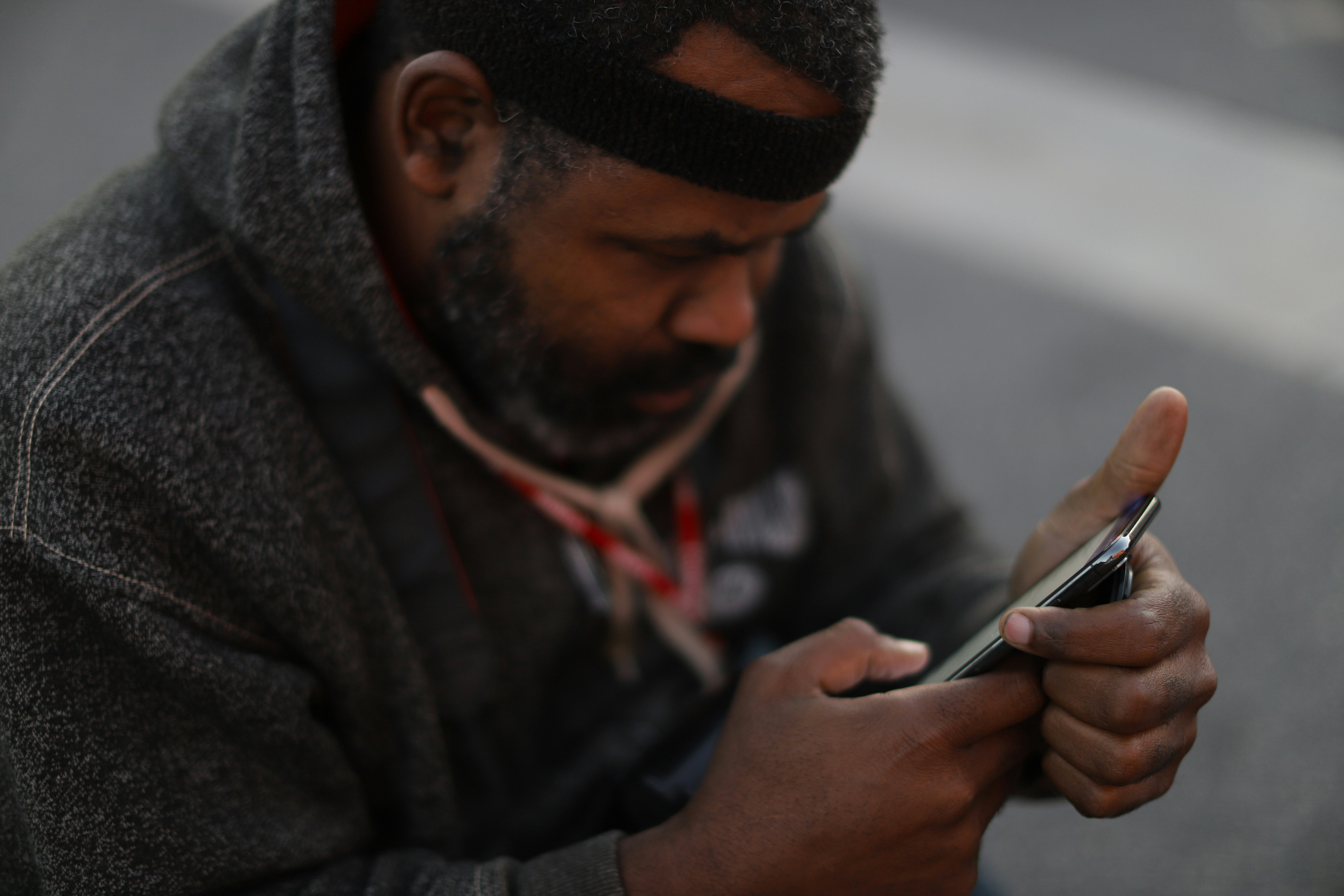 A man using a cell phone photo – Free Black Image on Unsplash