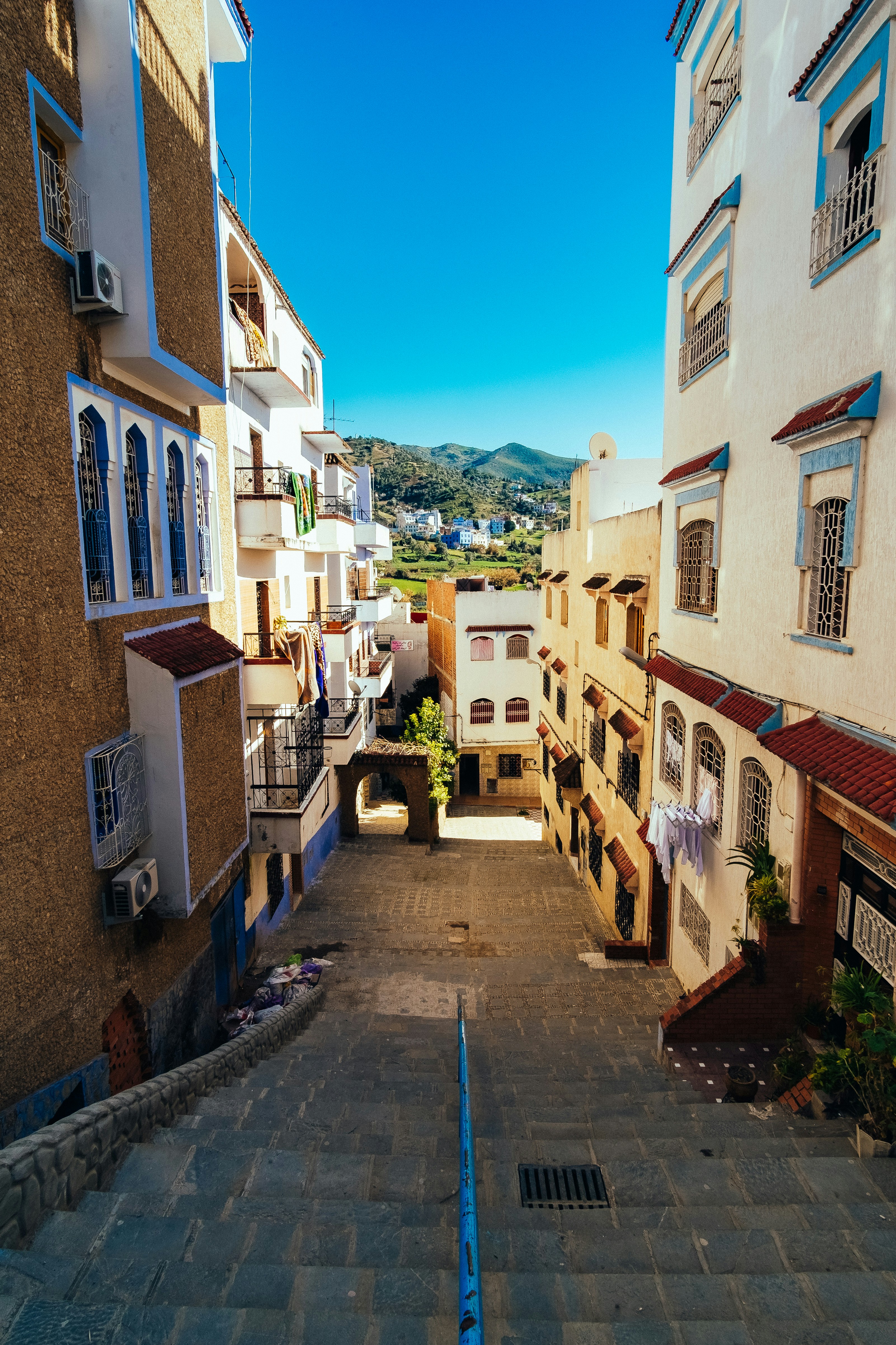 A cobblestone street with buildings on both sides photo – Free Morocco ...