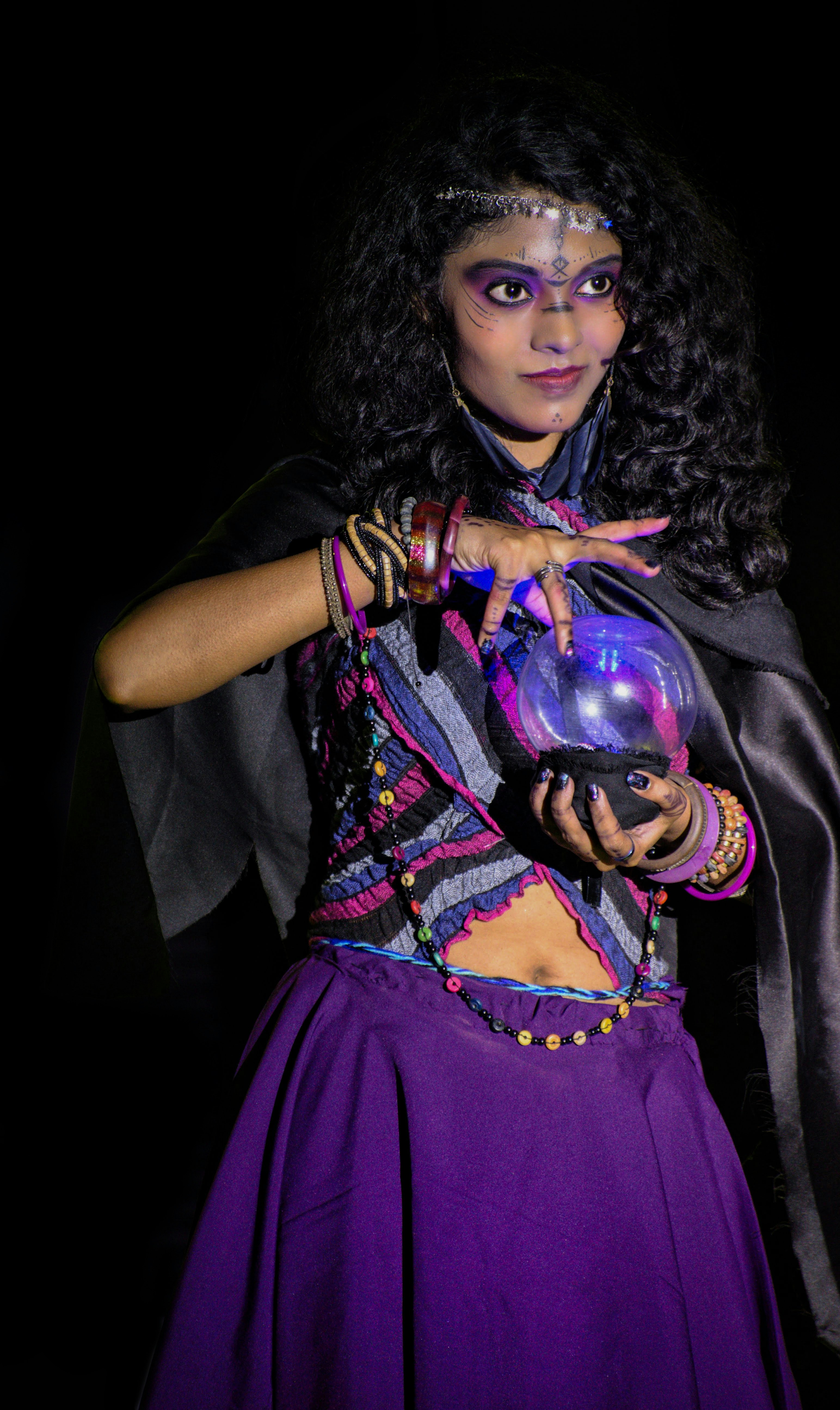 A person with a purple dress and a purple mask photo – Free Black Image ...