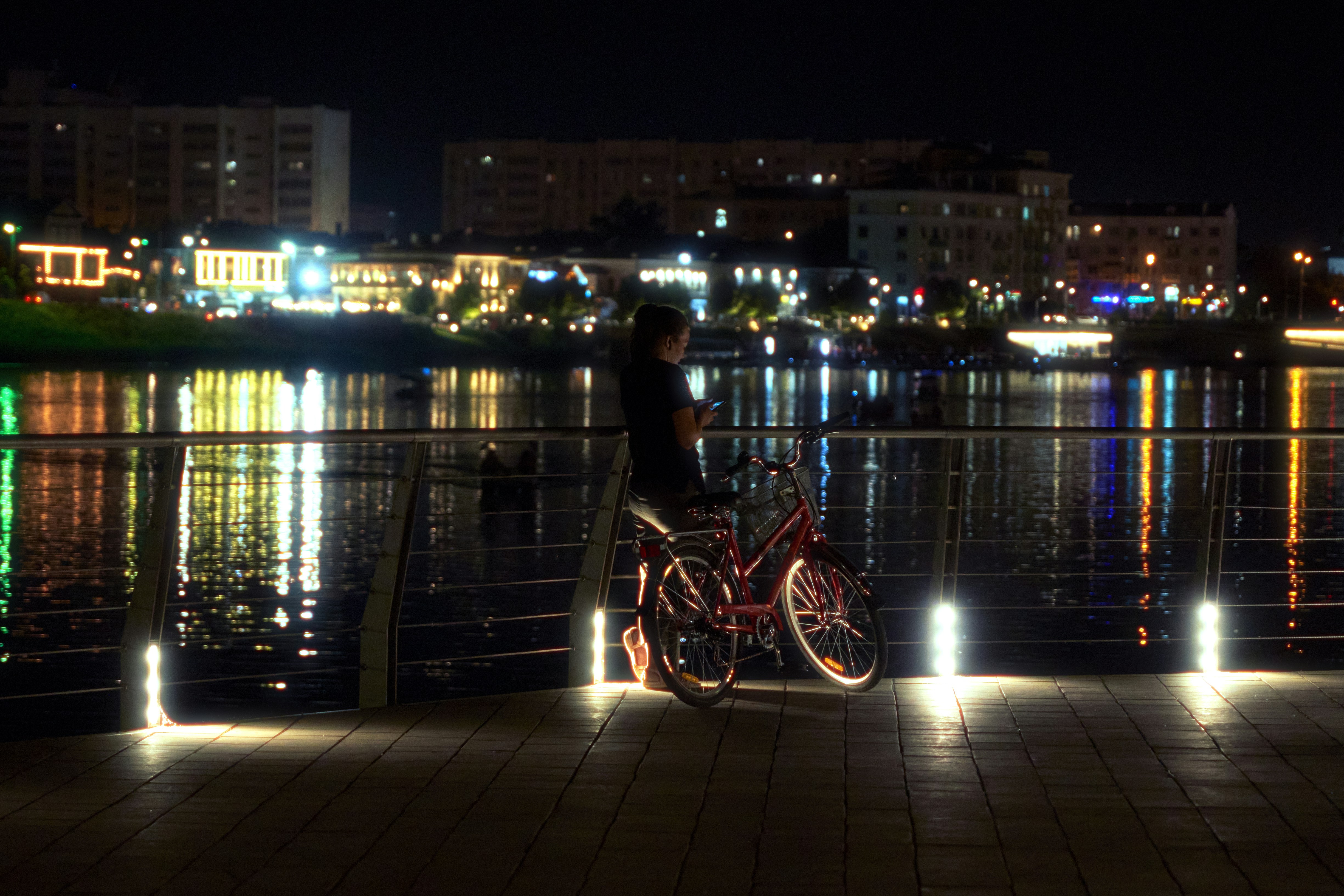 Night Rider by the Waterfront: A Quiet Moment with a Bicycle