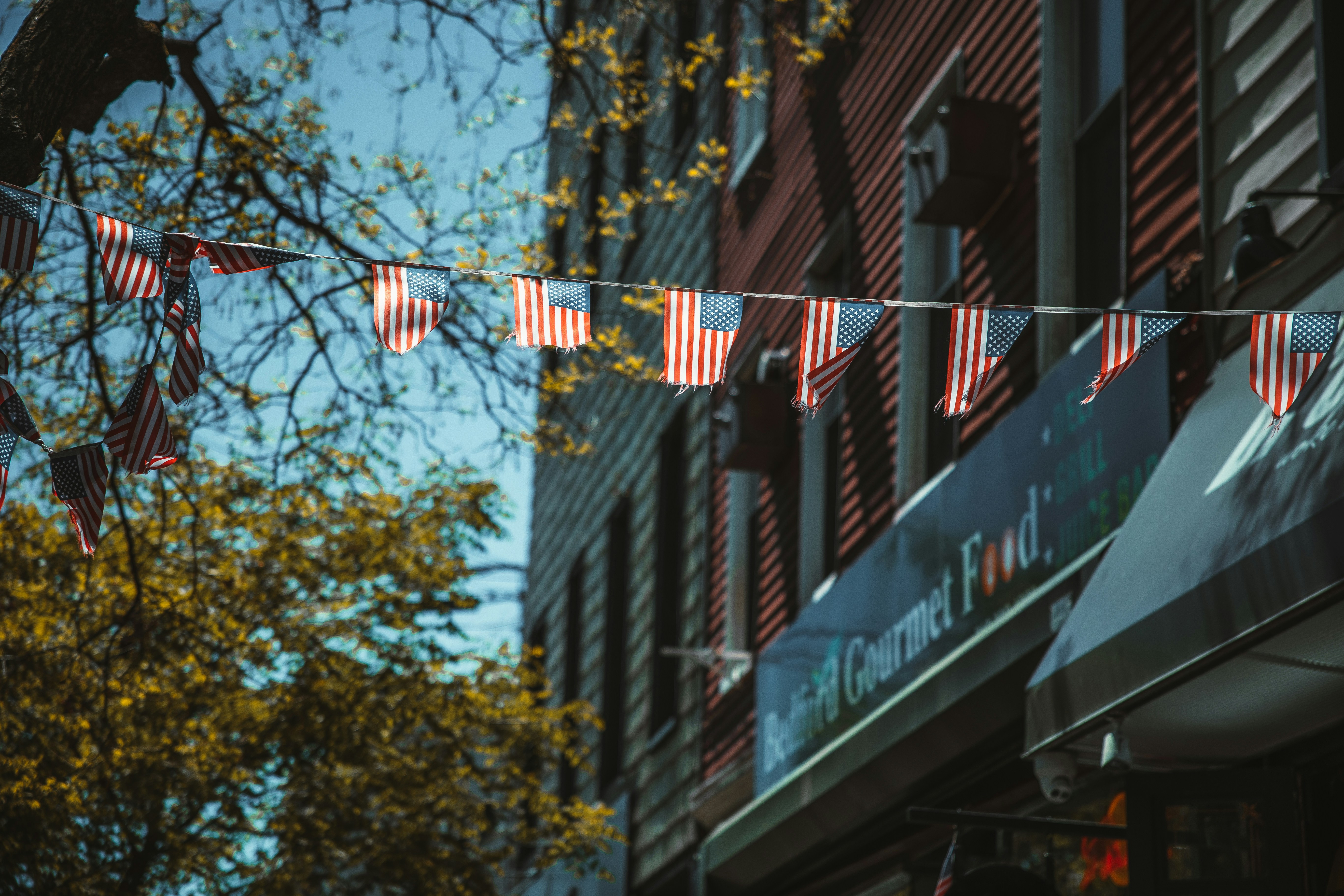 A building with flags from the roof photo – Free Building Image on Unsplash