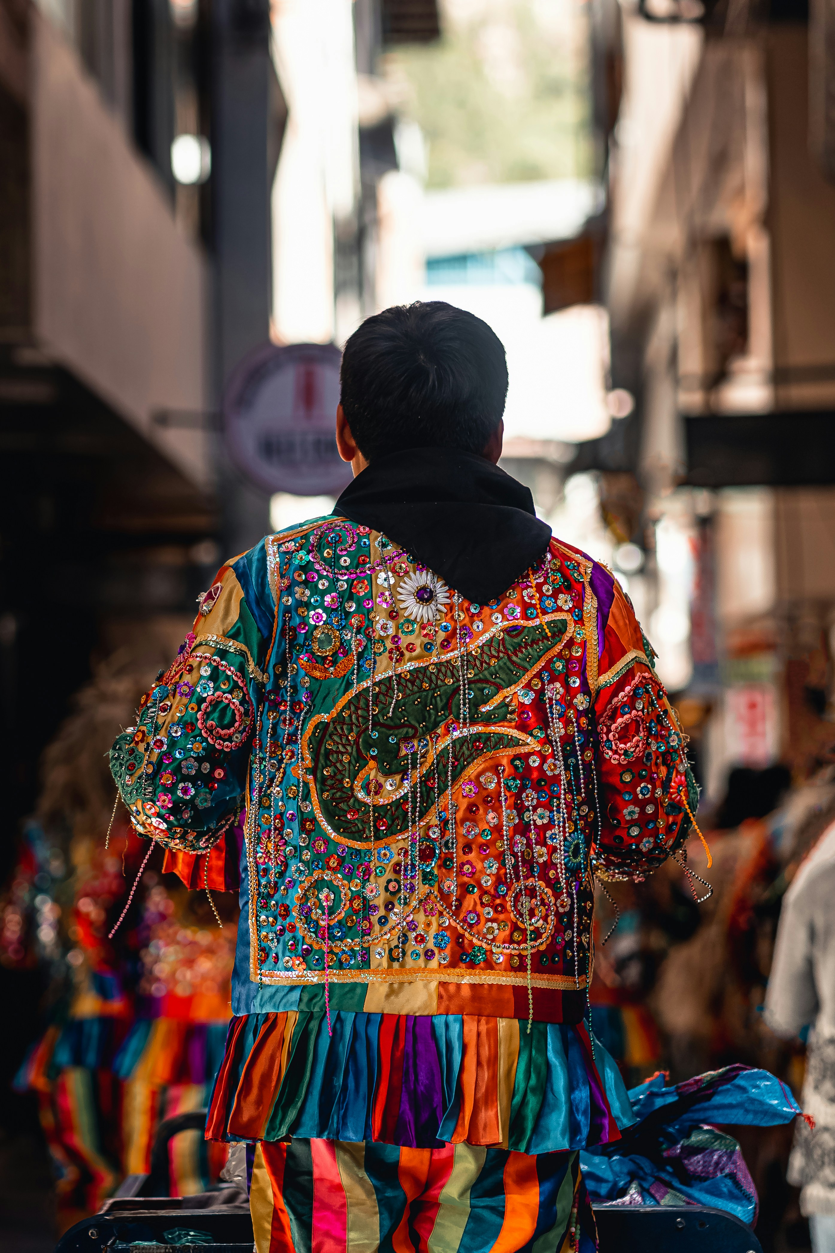 Vivid Backdrop: A Colorful Garment Steals the Street Scene