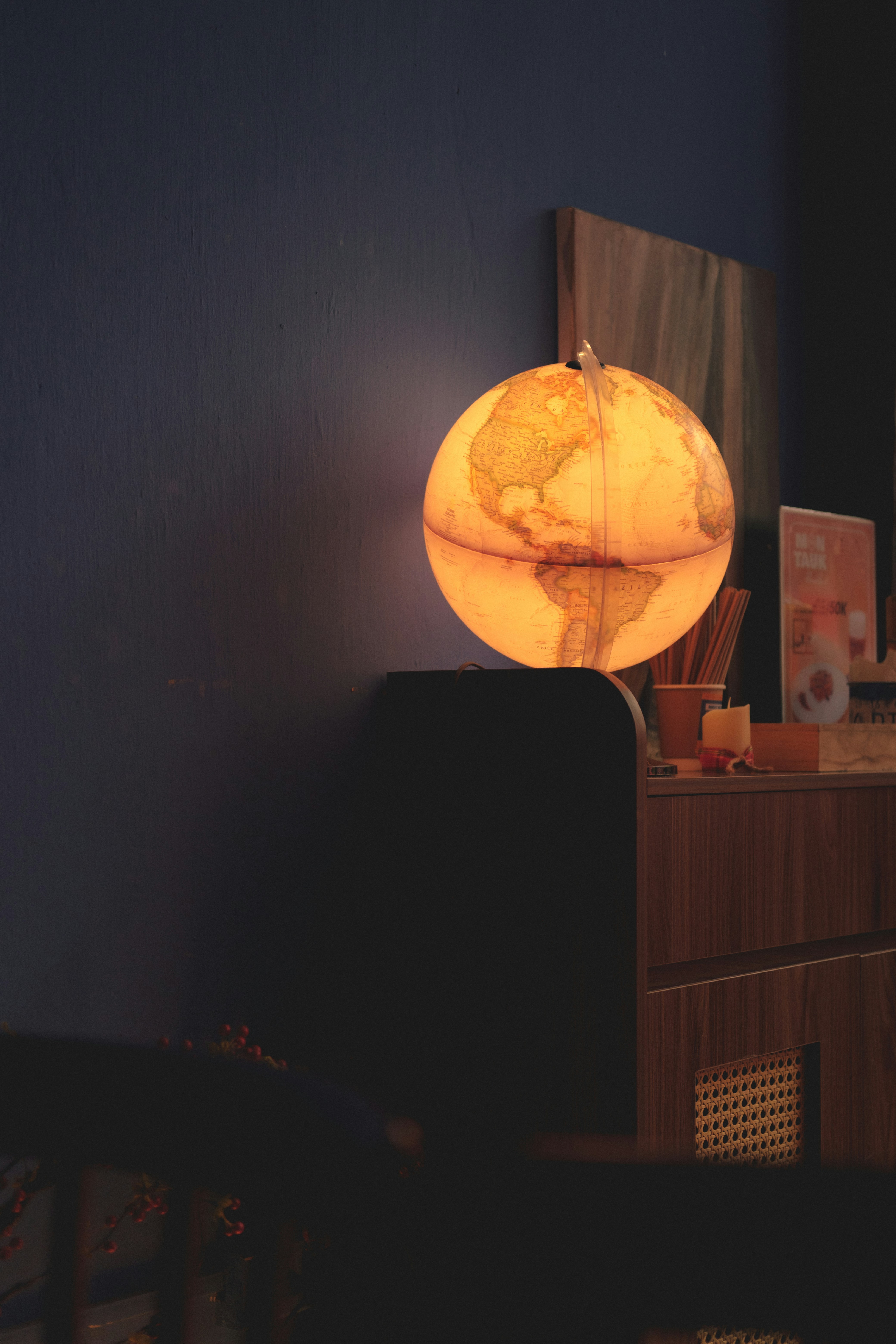 a round orange object on a black surface